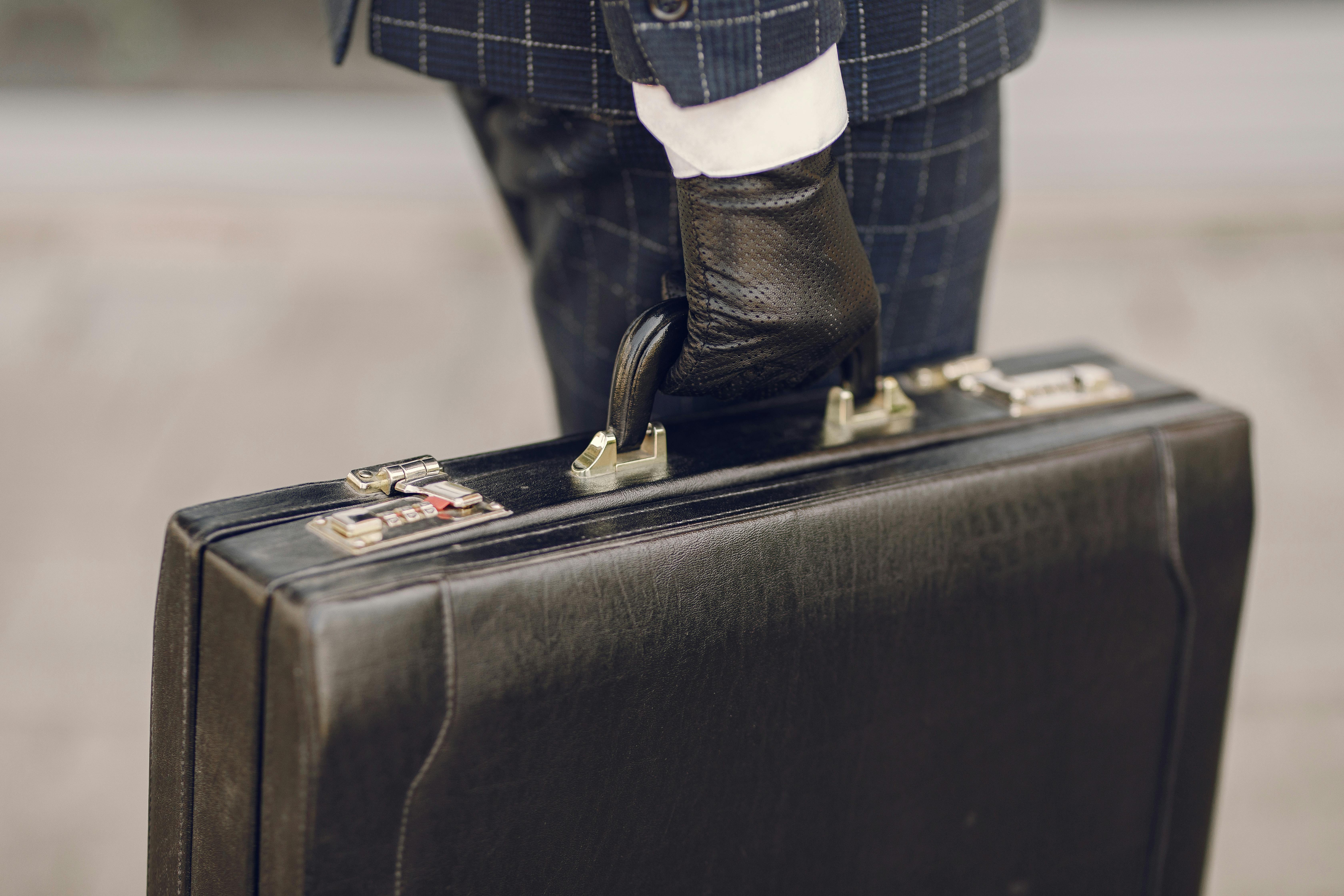 A Person Holding a Briefcase · Free Stock Photo