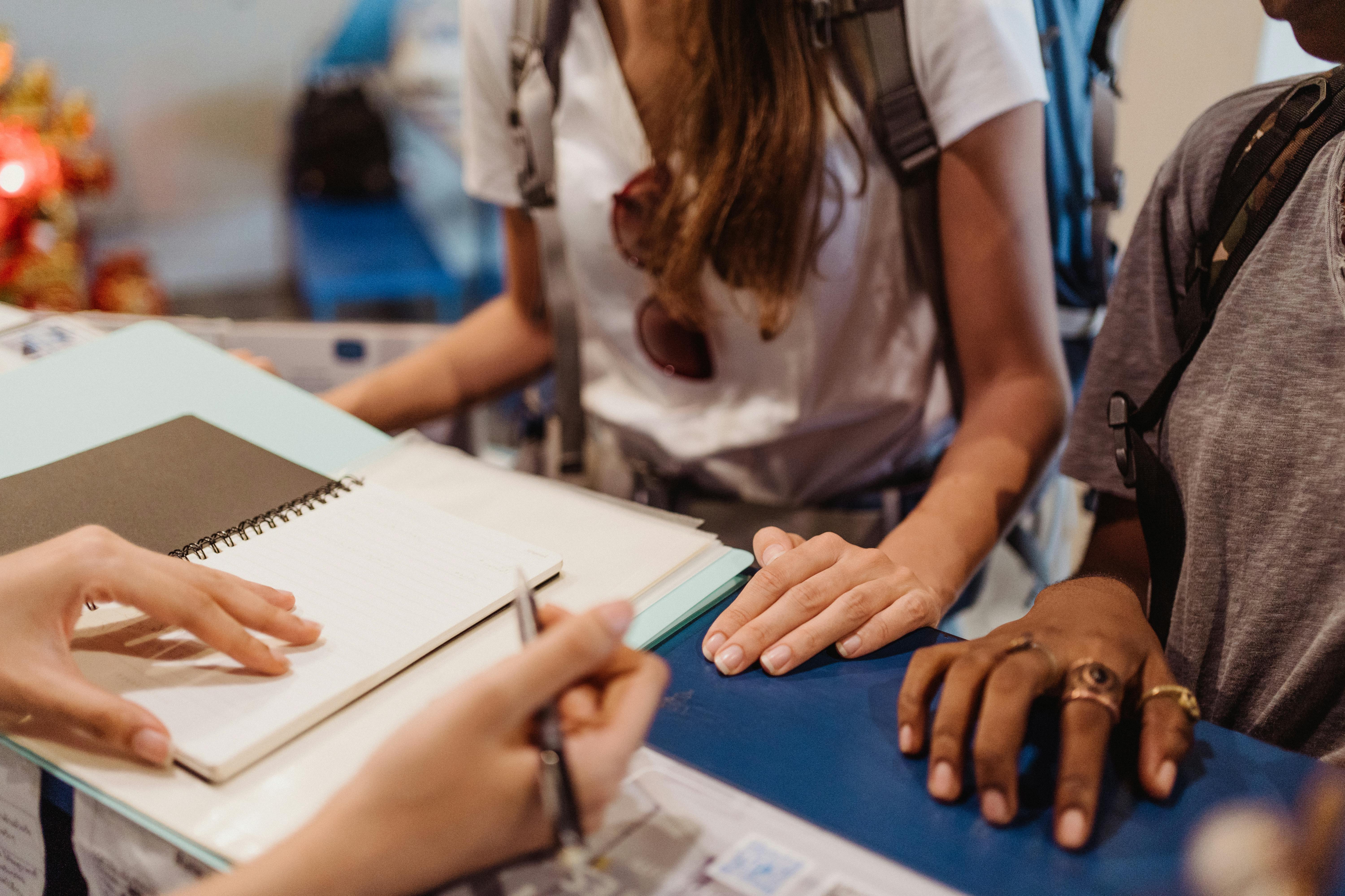 Man in White Crew Neck Shirt Doing His Homework · Free Stock Photo