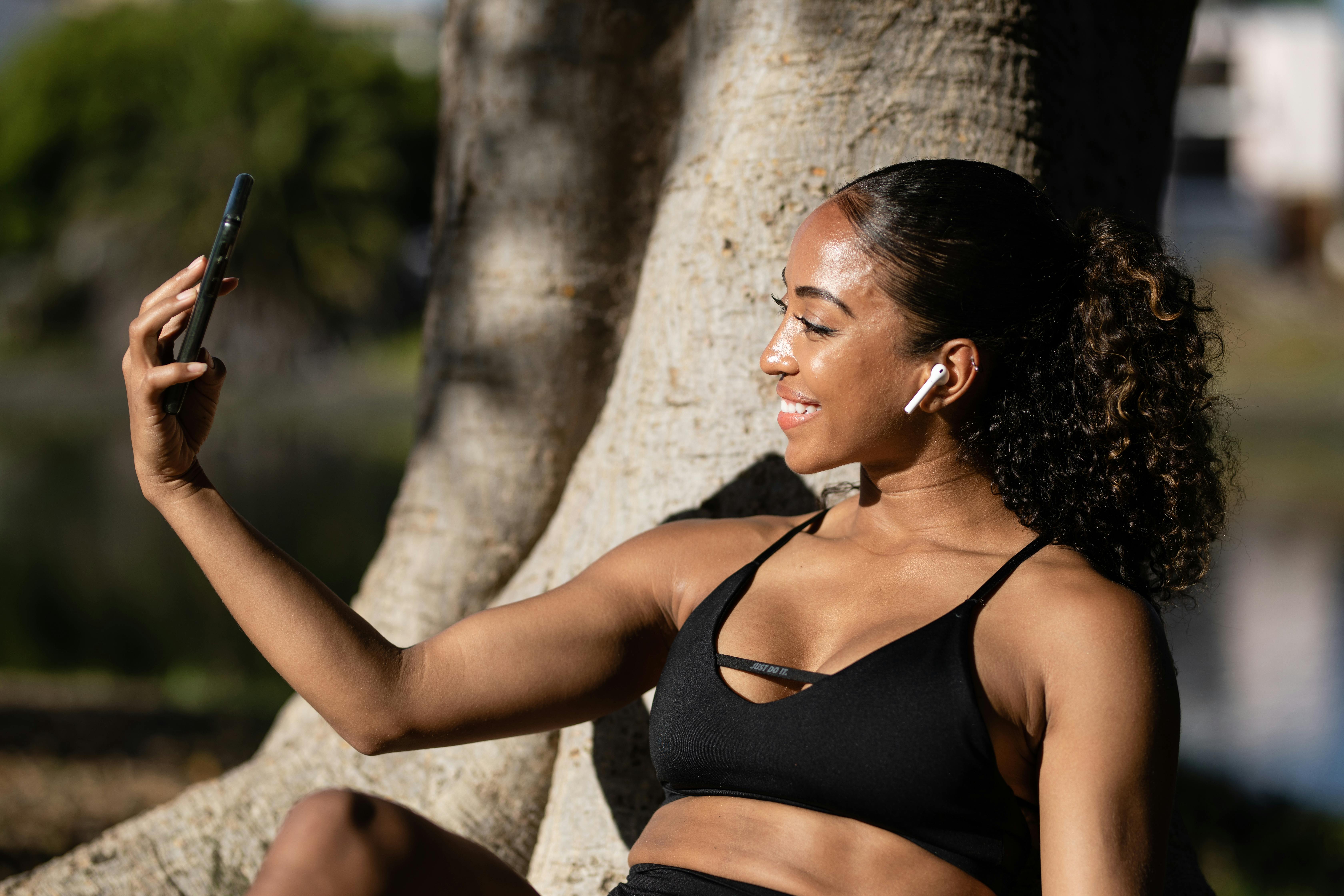 Person Taking Selfie Beside a Tree · Free Stock Photo