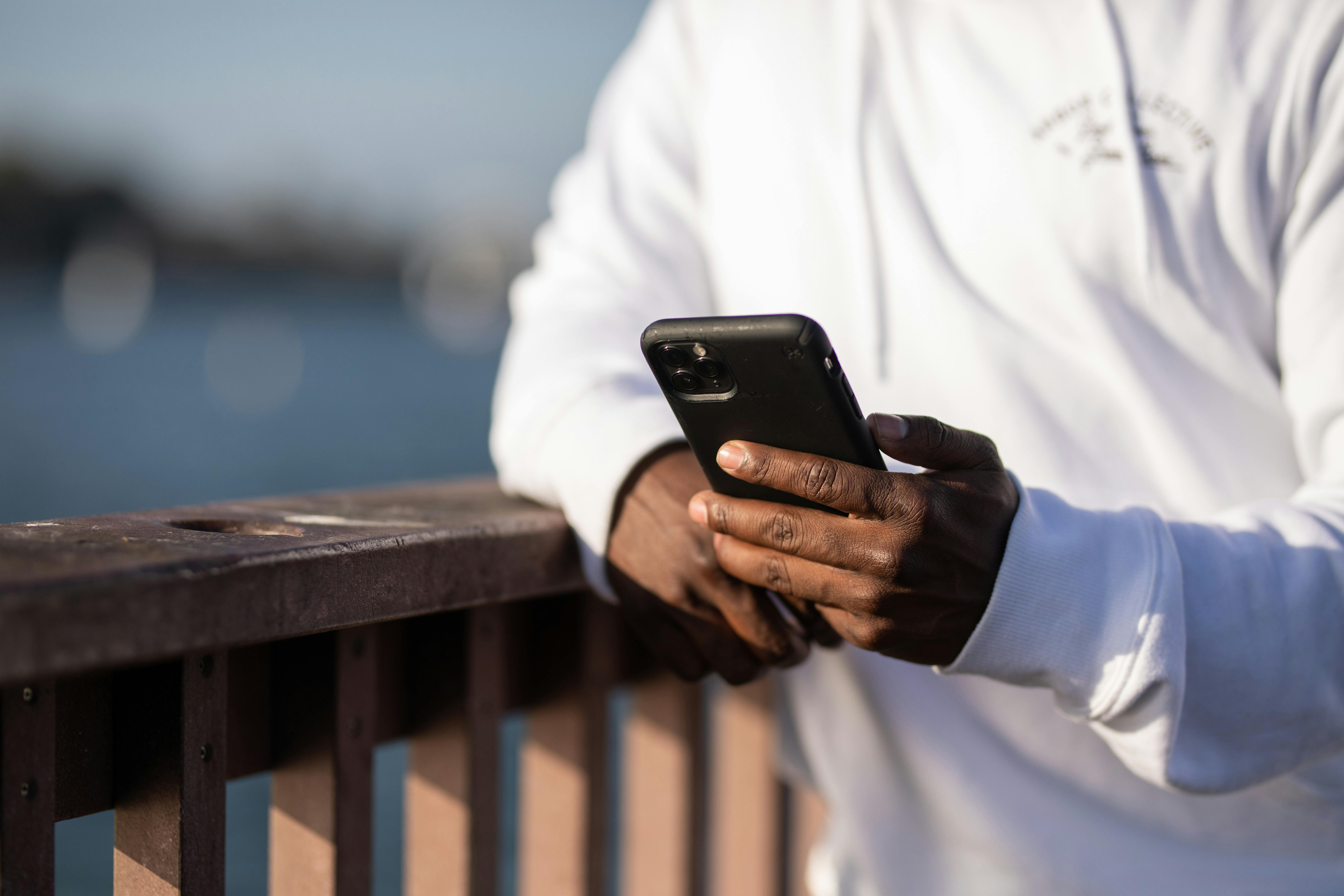 Close Up Photo of a Person Holding a Cellphone · Free Stock Photo