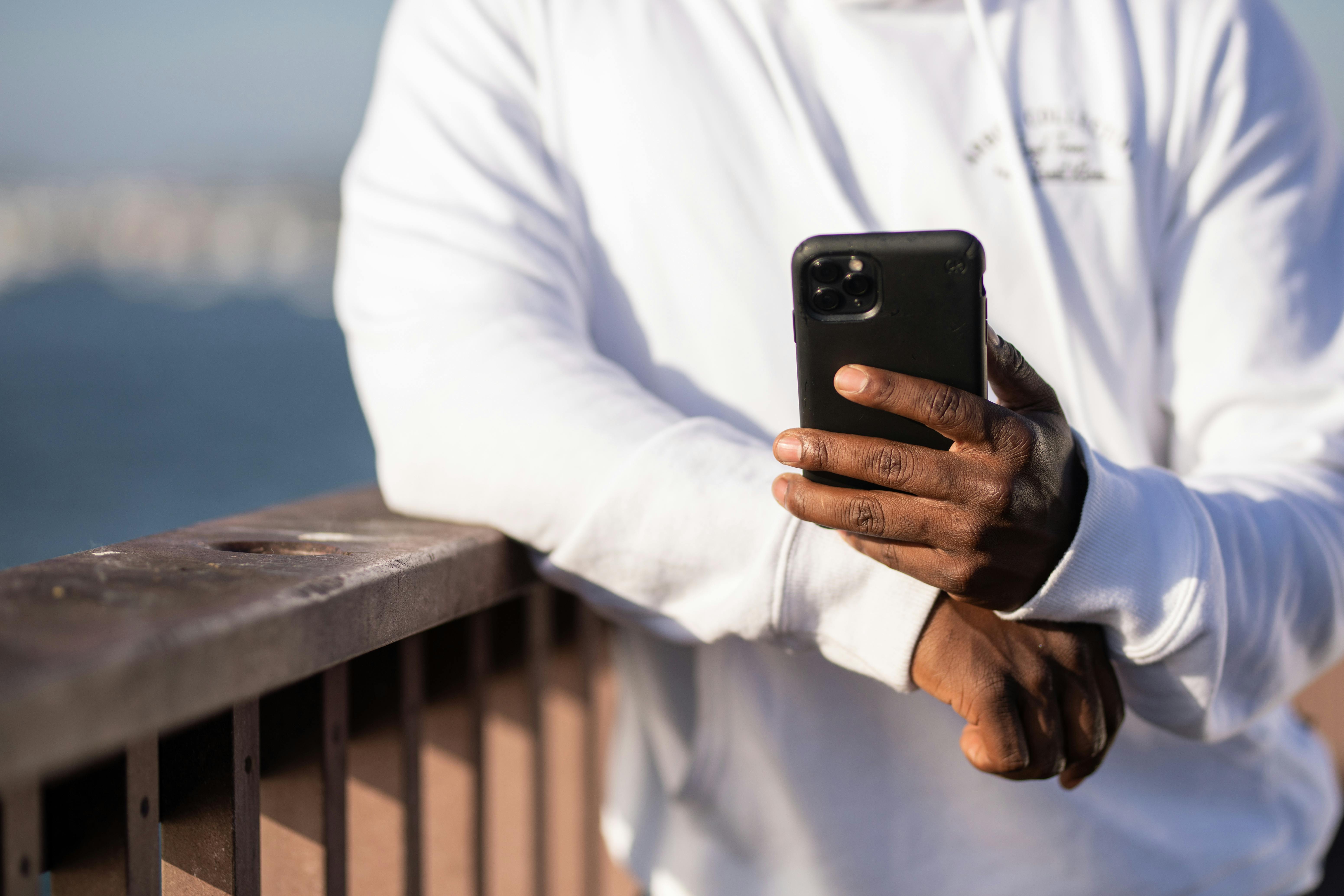 Close-Up Photo Of Woman Using Her Mobile Phone · Free Stock Photo