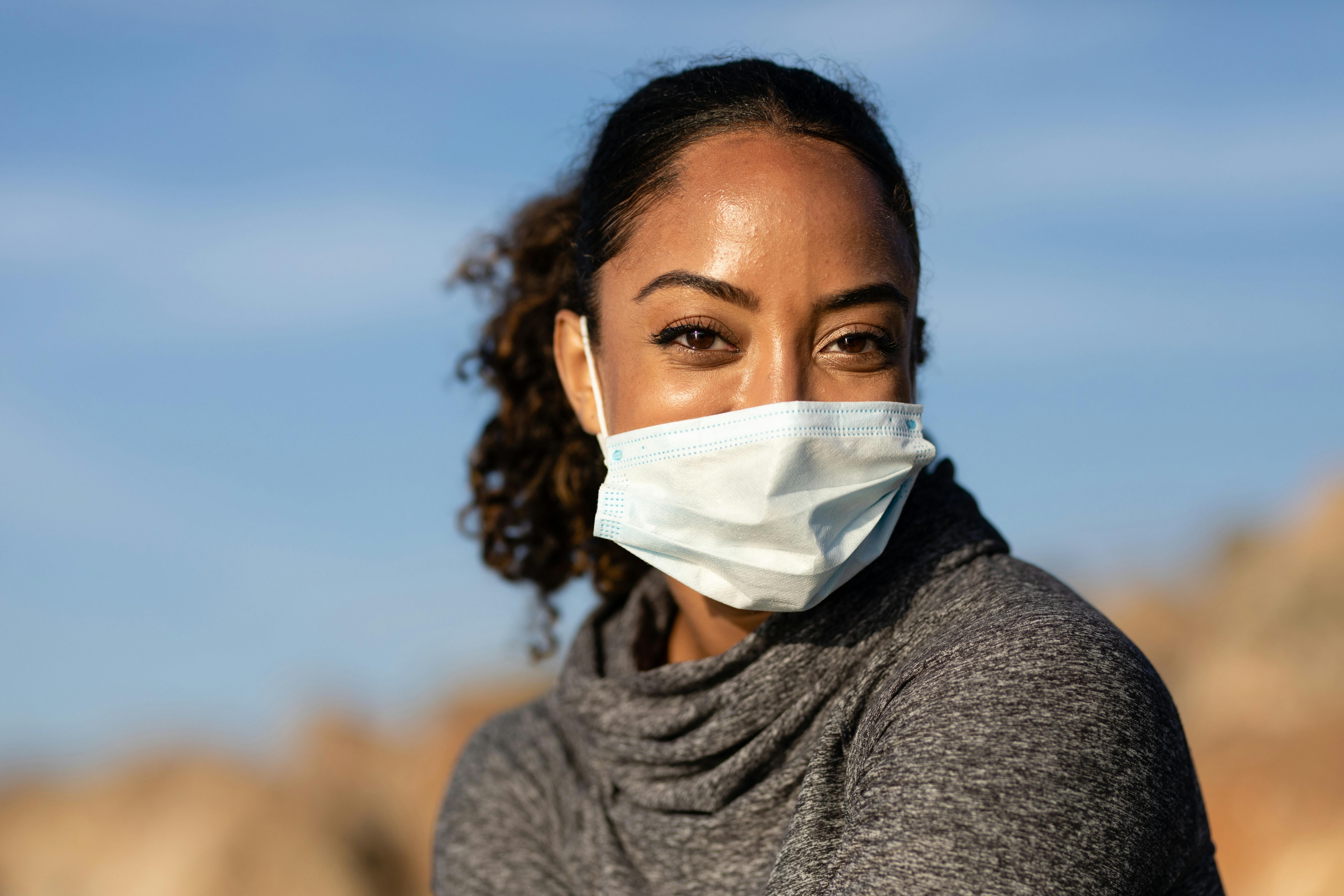 A Woman Posing in a Face Mask · Free Stock Photo