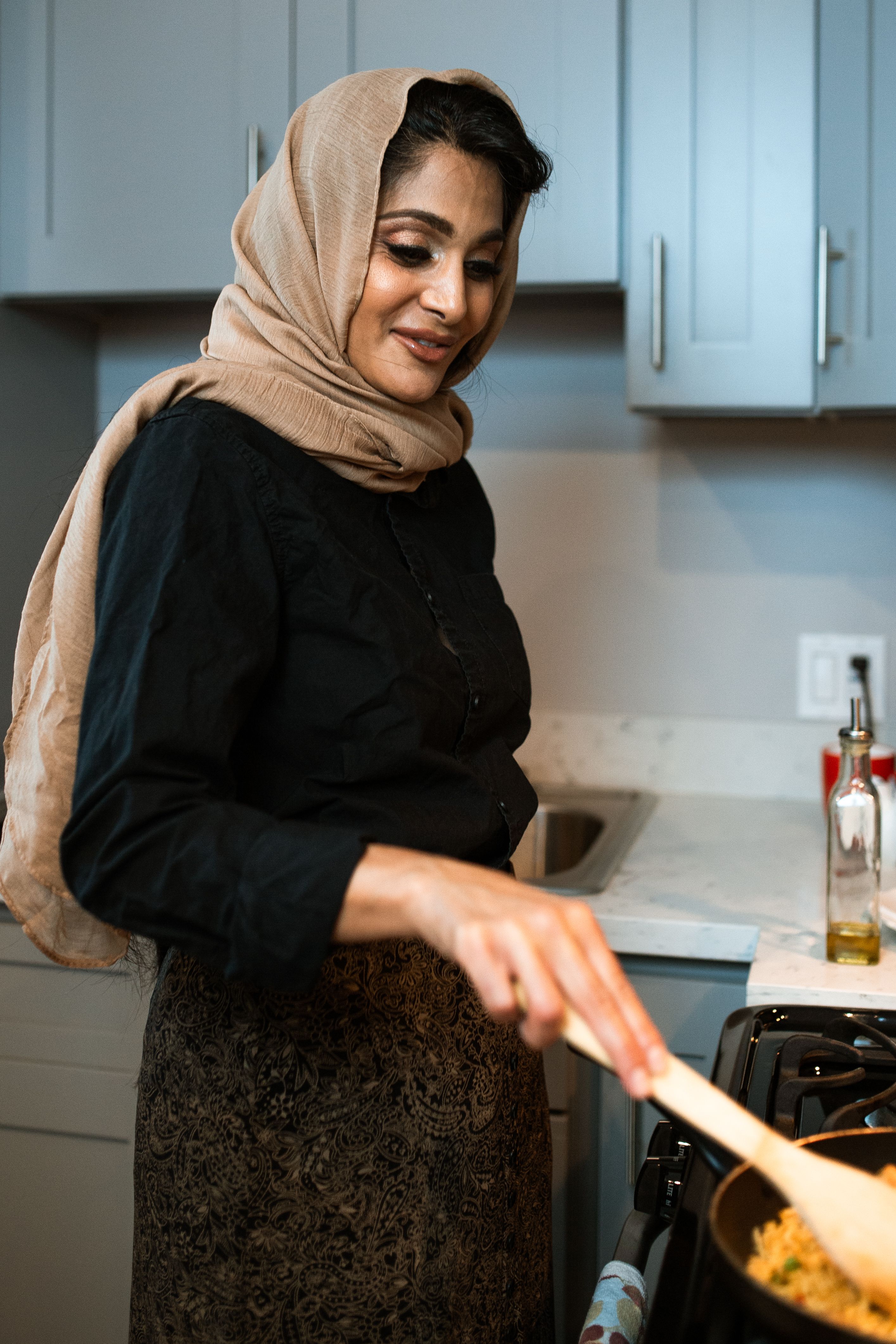 A Woman Cooking in a Kitchen · Free Stock Photo
