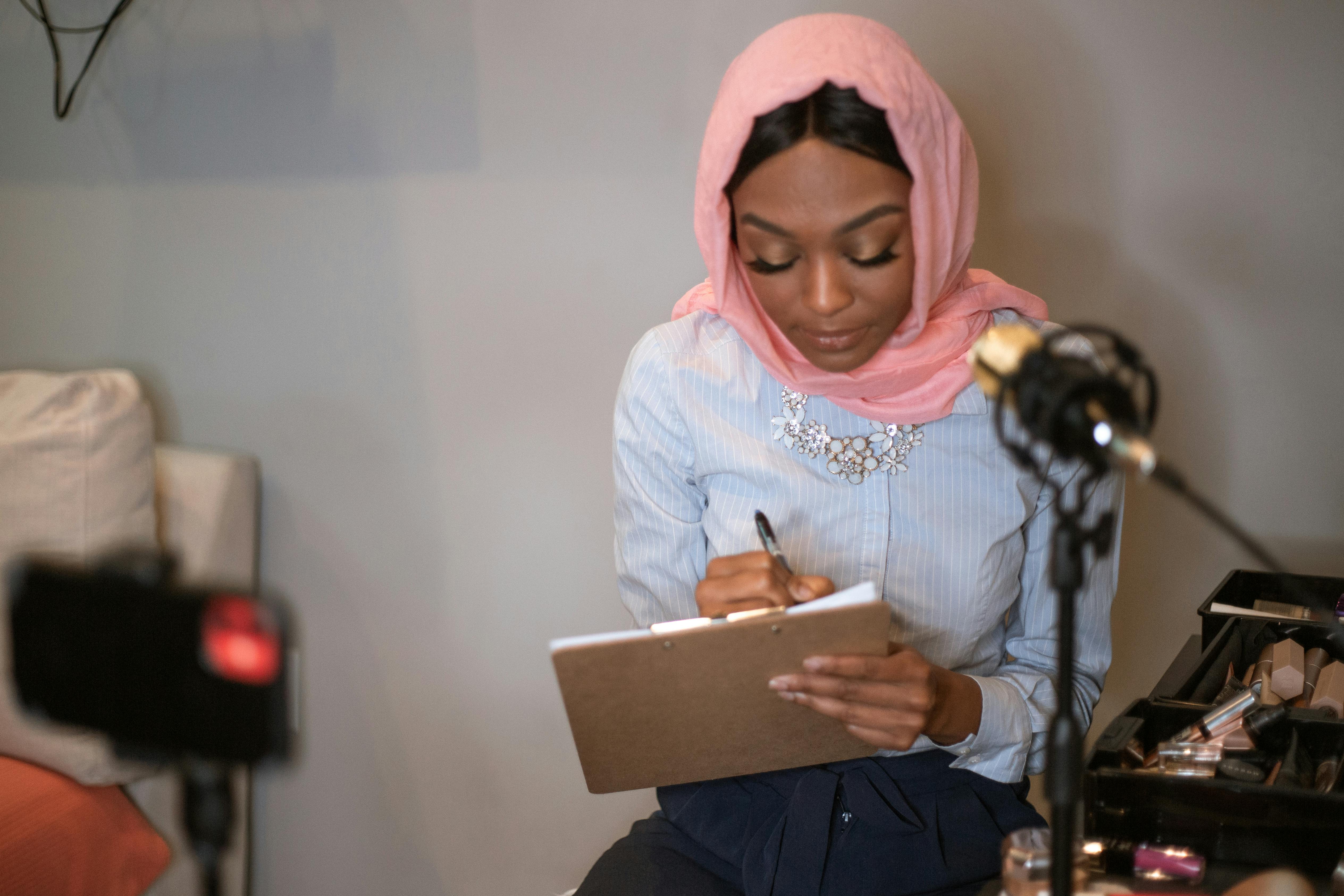 Female Vlogger in Traditional Headwear and a Brown Fedora Hat · Free ...