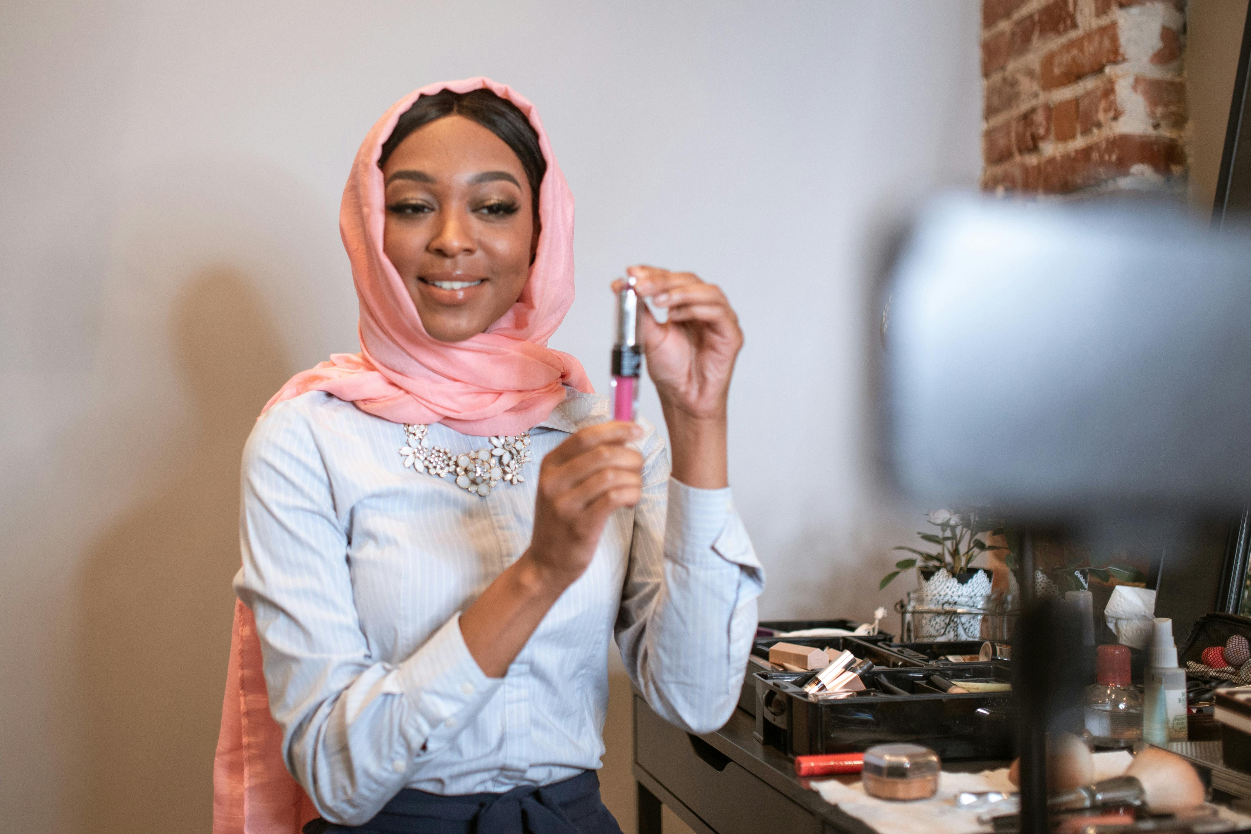 Female Vlogger in Pink Hijab doing a Video Vlog · Free Stock Photo
