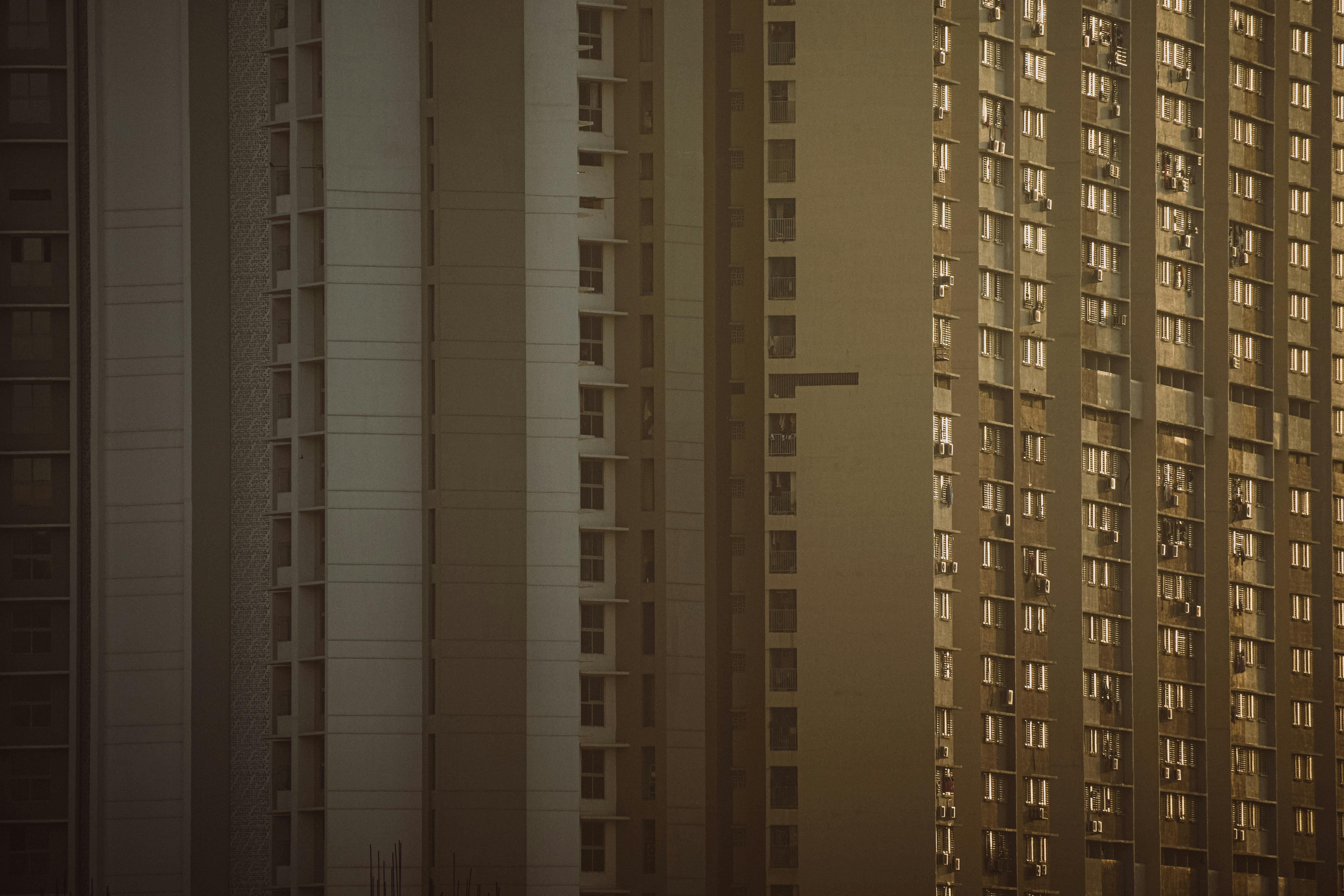 Grey Concrete Round High Rise Building · Free Stock Photo