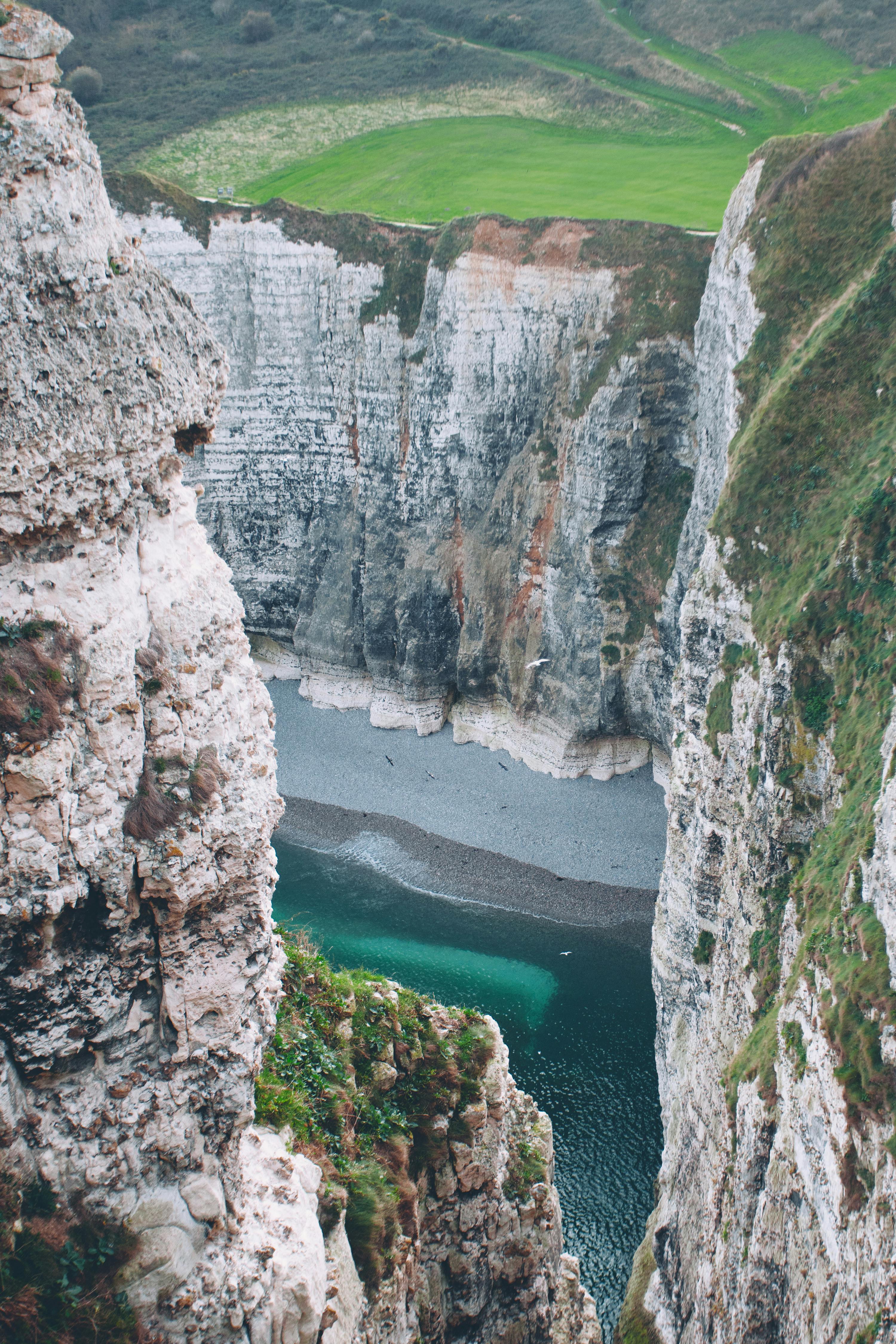 Wooden pier corner above calm rippling lake · Free Stock Photo
