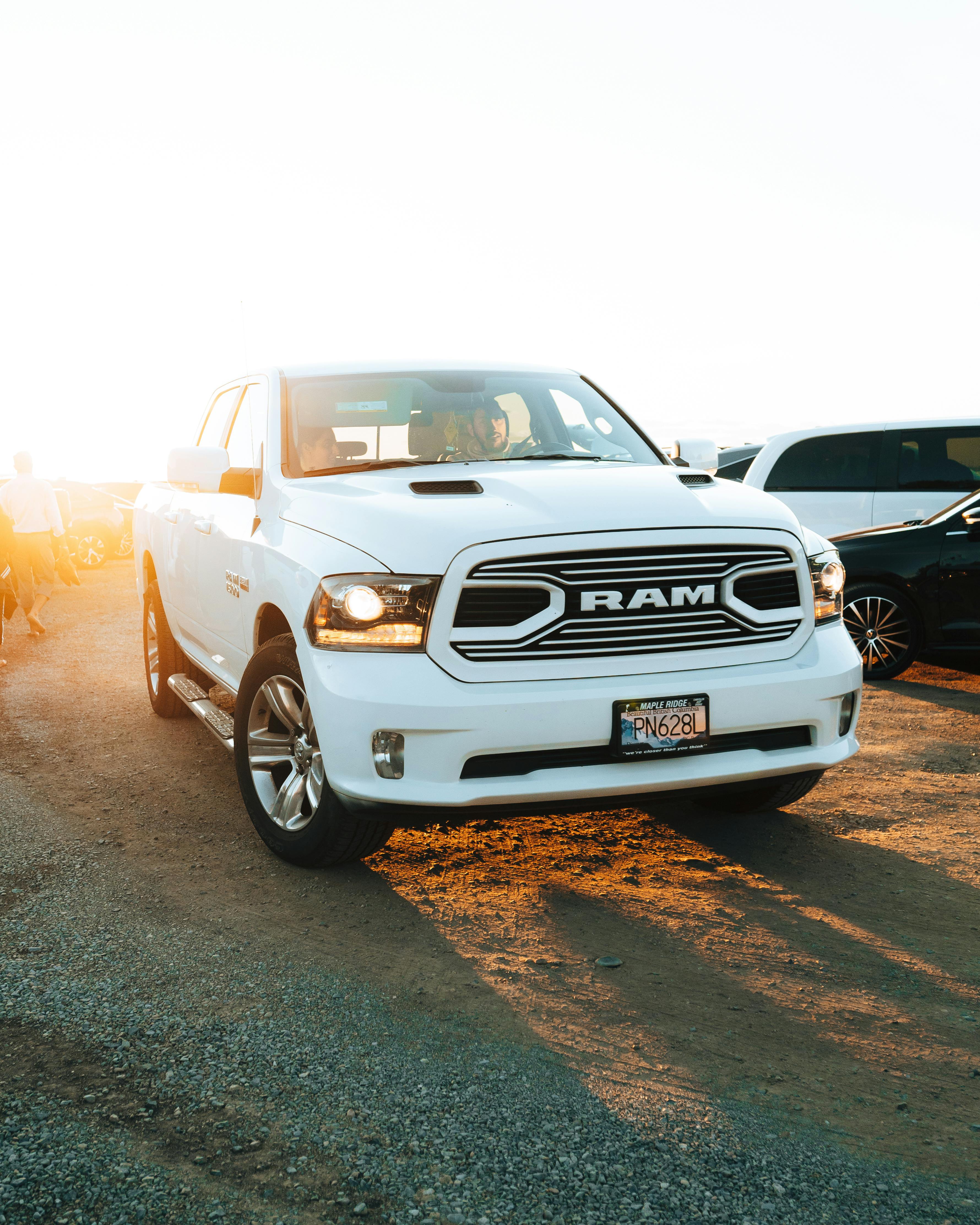 Trunk parked on paved road covered with pebbles at sunset · Free Stock ...