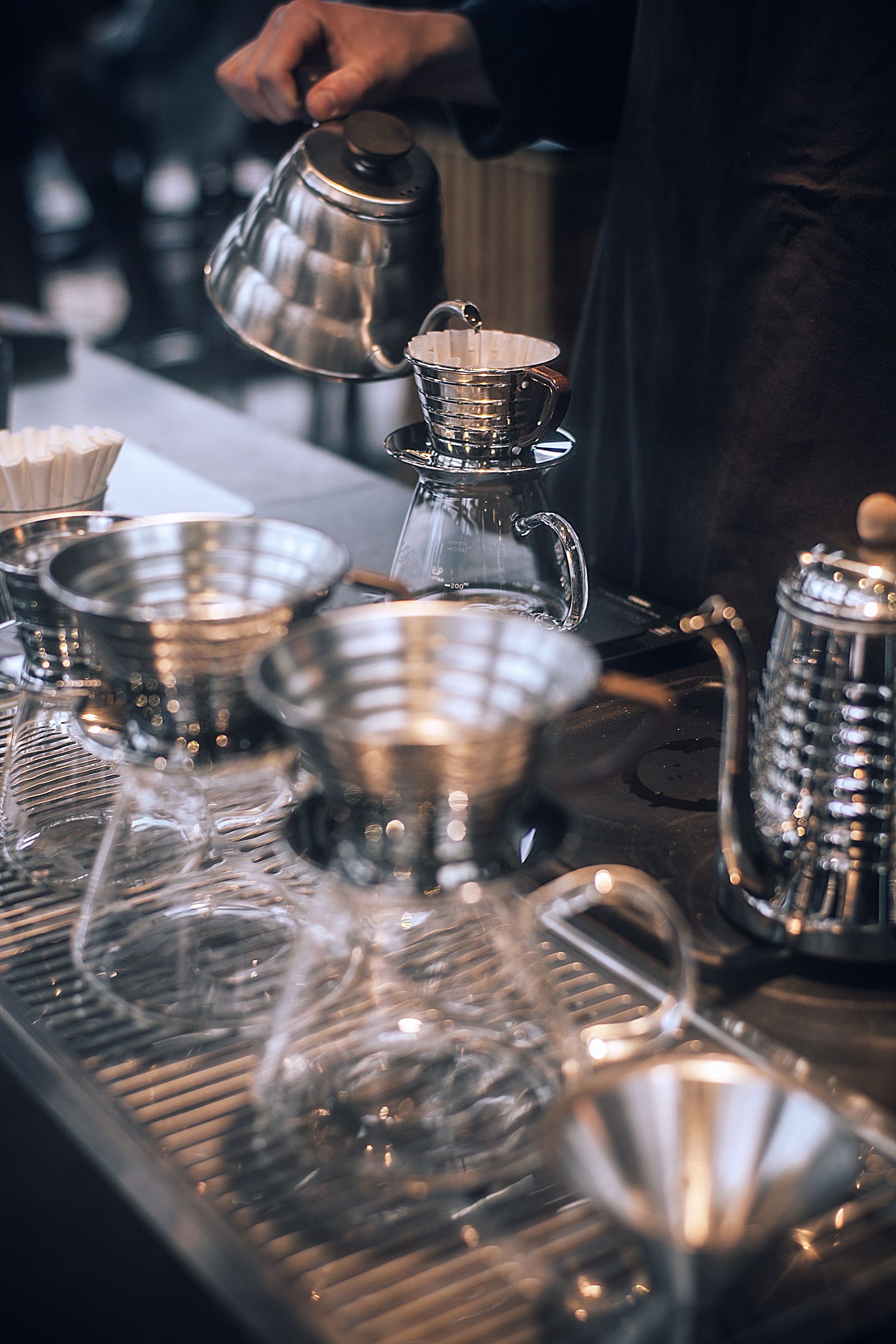 Crop barista preparing coffee using metal pot · Free Stock Photo