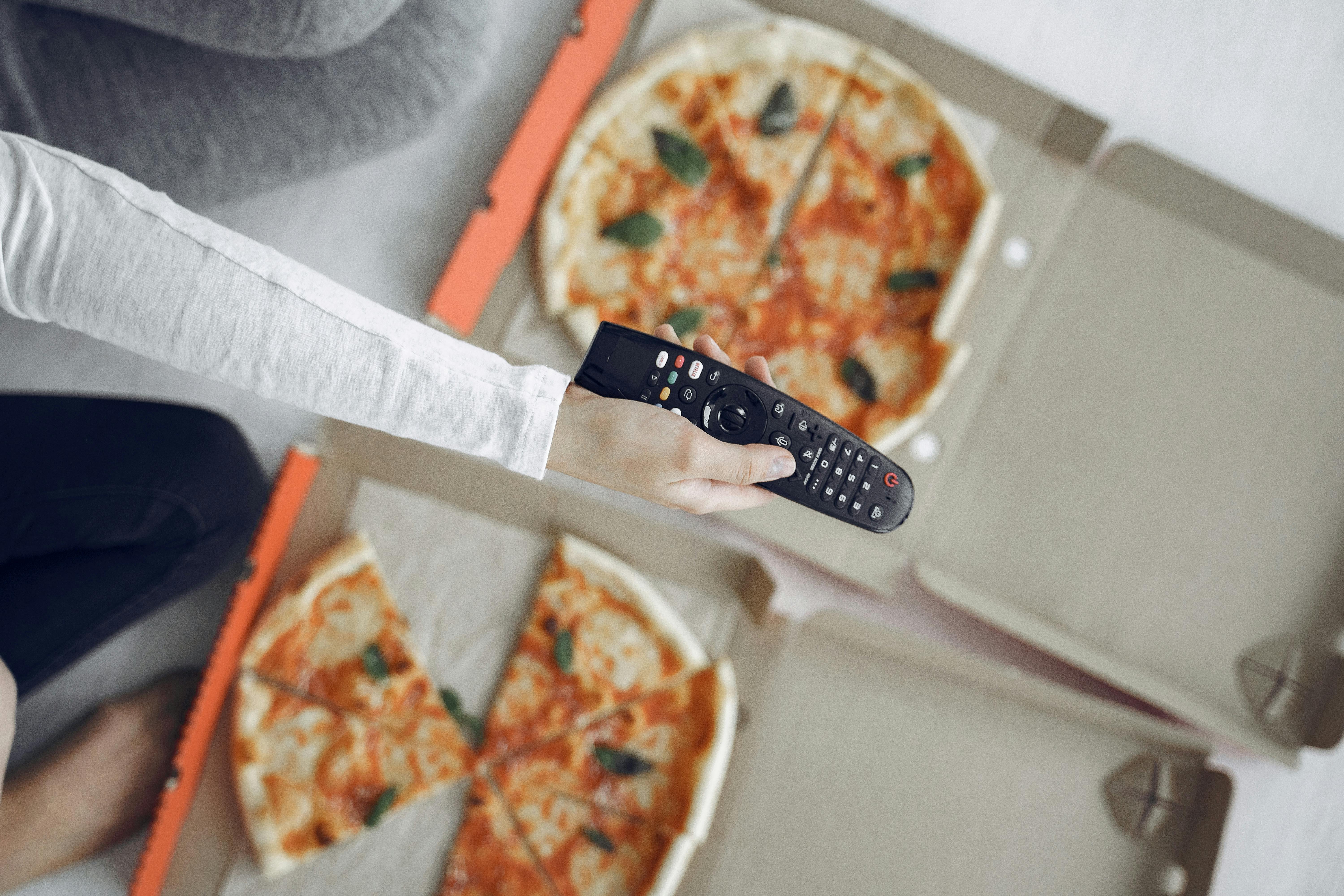 Game Controller beside Pizzas · Free Stock Photo