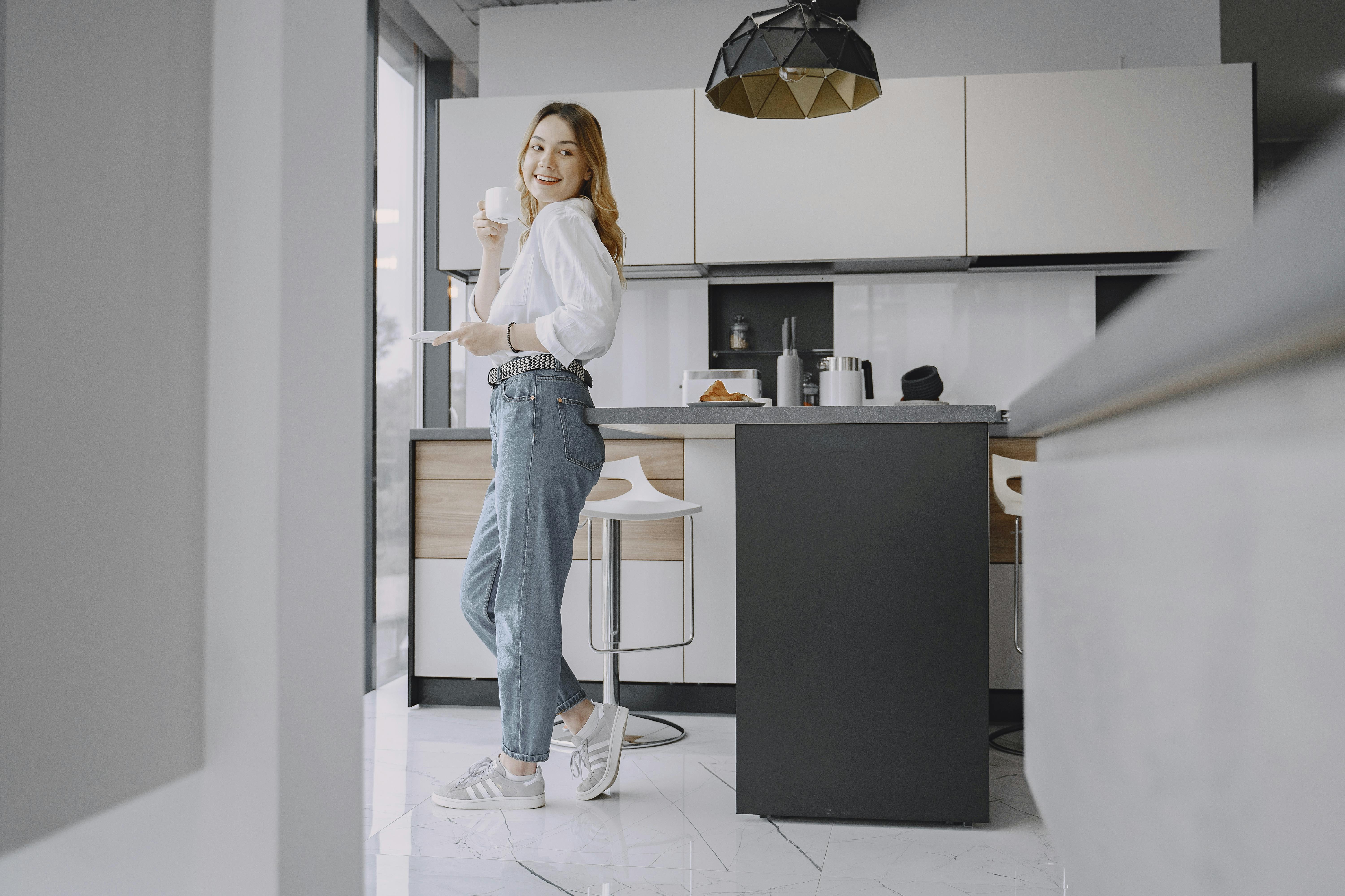 Stylish Woman leaning on a Counter Top · Free Stock Photo