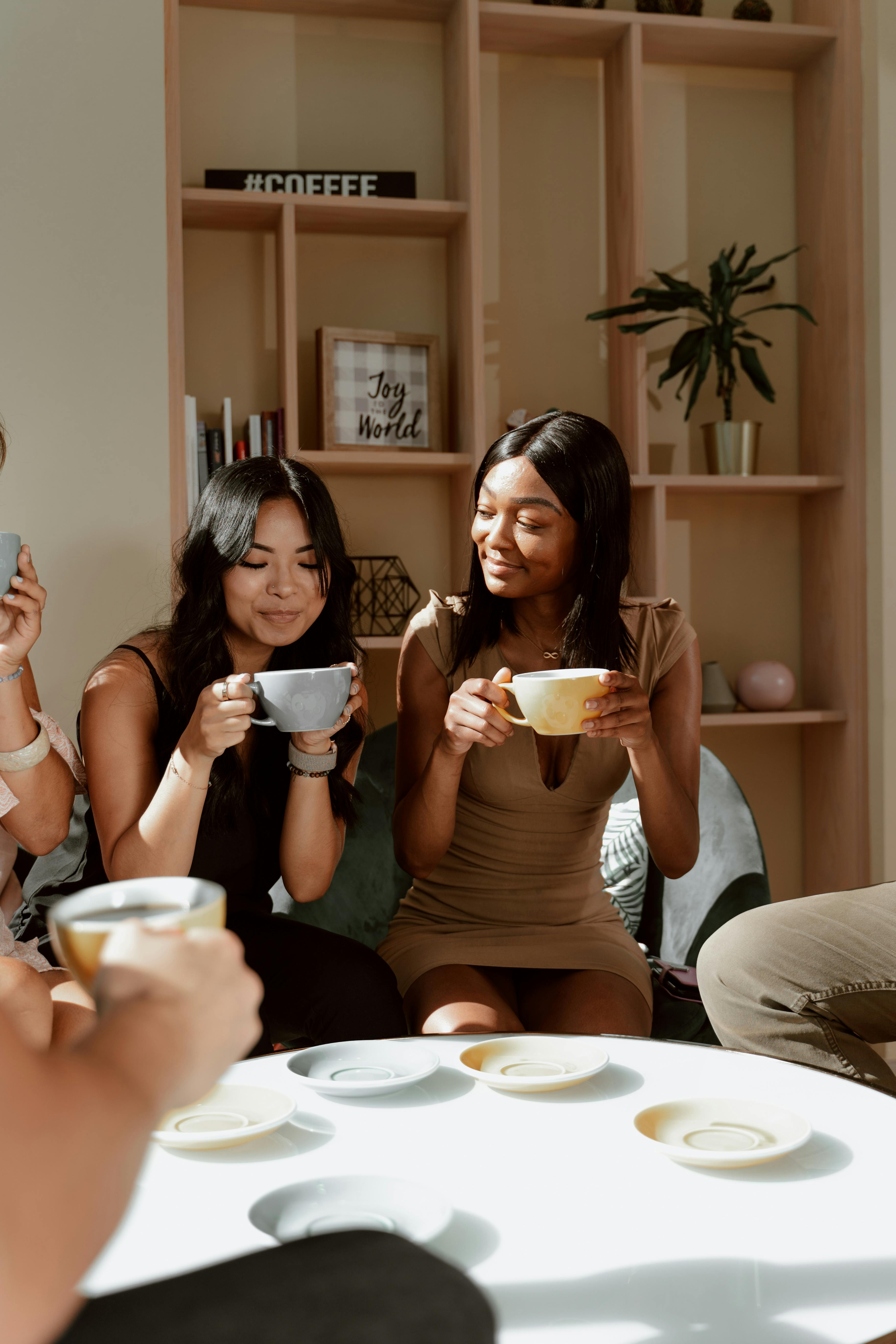 Happy Women sitting beside each other · Free Stock Photo
