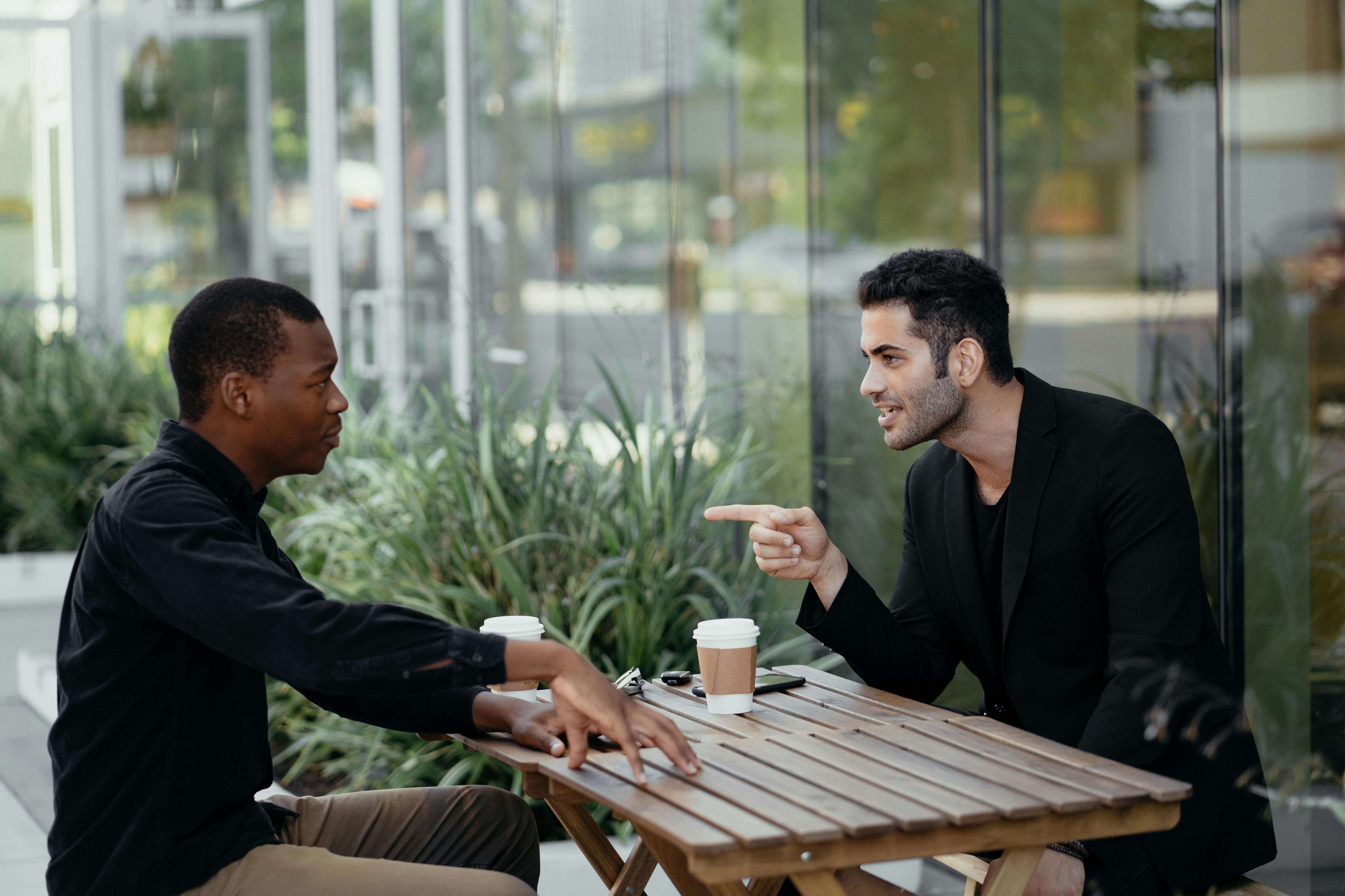 Two Men Having a Conversation · Free Stock Photo