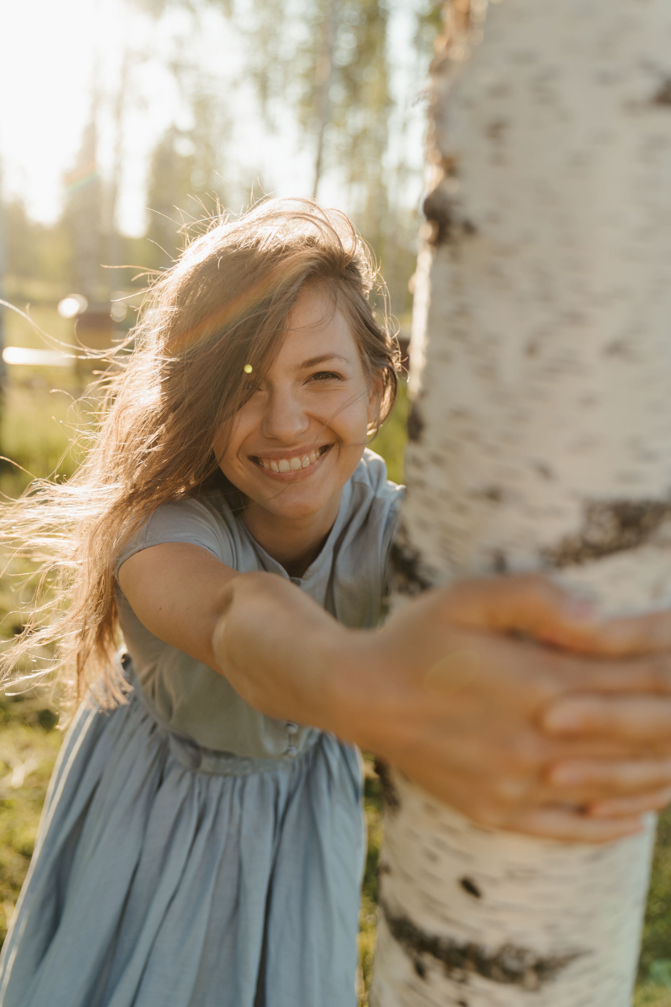 Girl in Gray Dress Standing on Green Grass Field · Free Stock Photo
