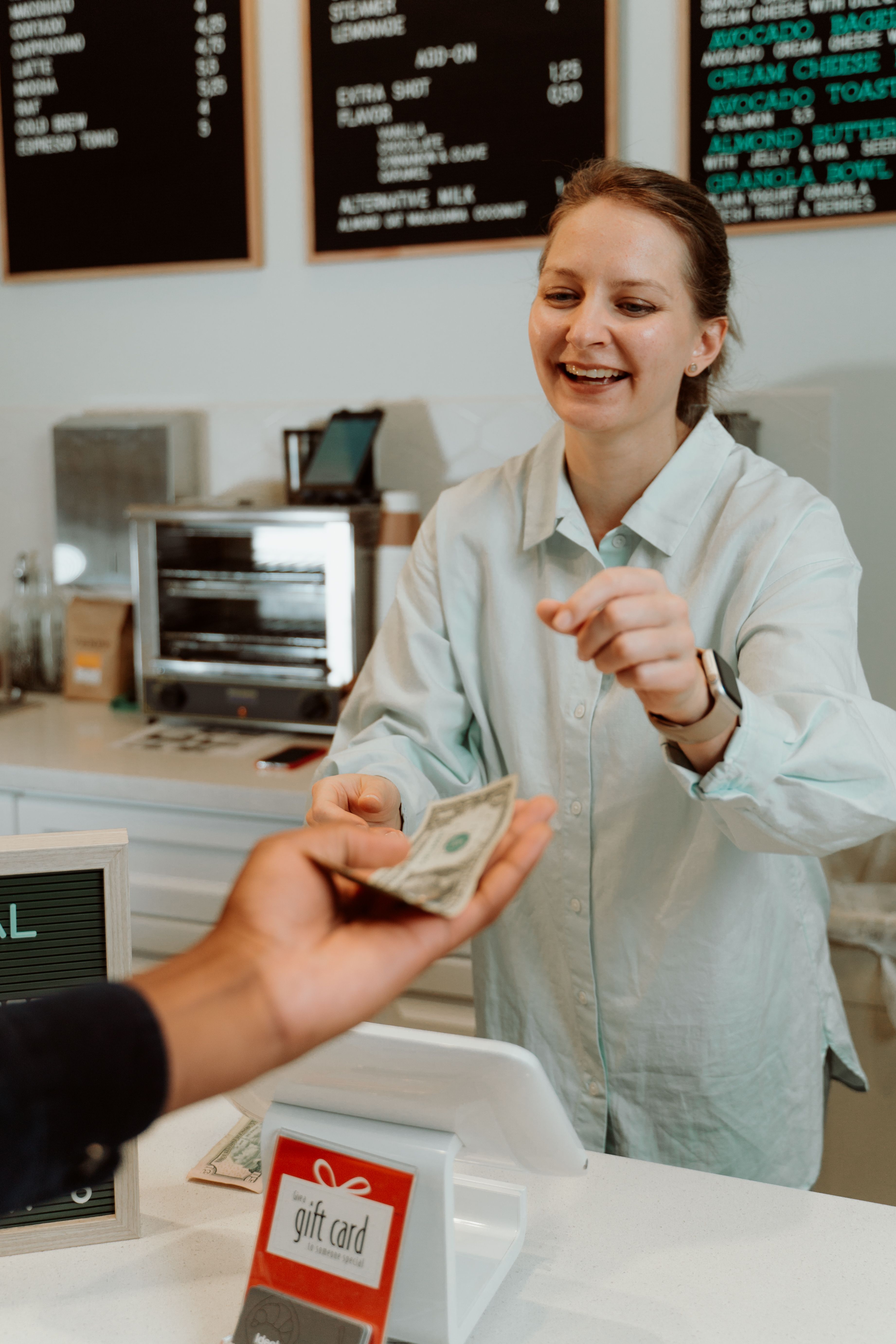Person paying on a Cashier · Free Stock Photo