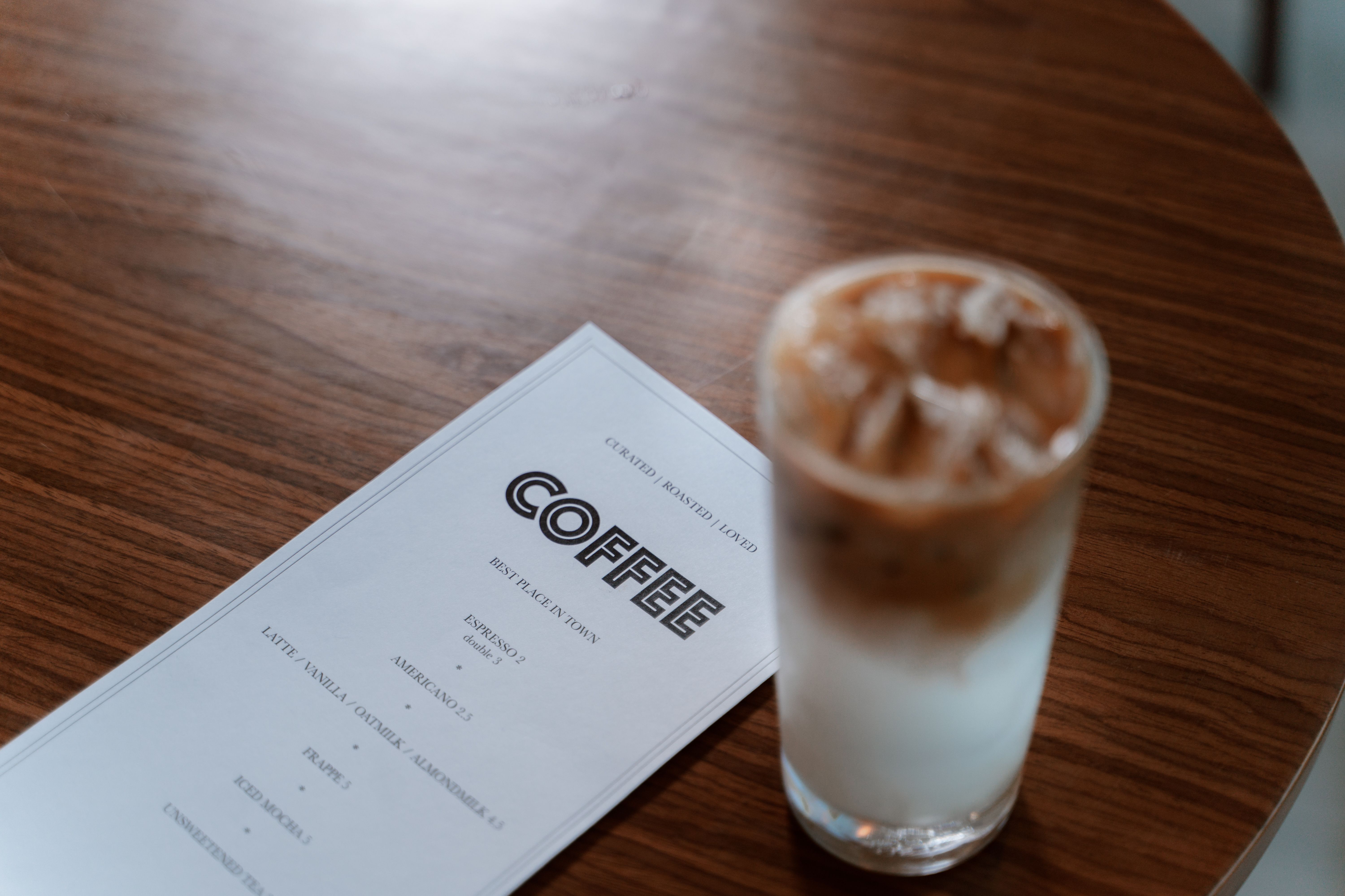 A Coffee Menu Placed on Wooden Table · Free Stock Photo
