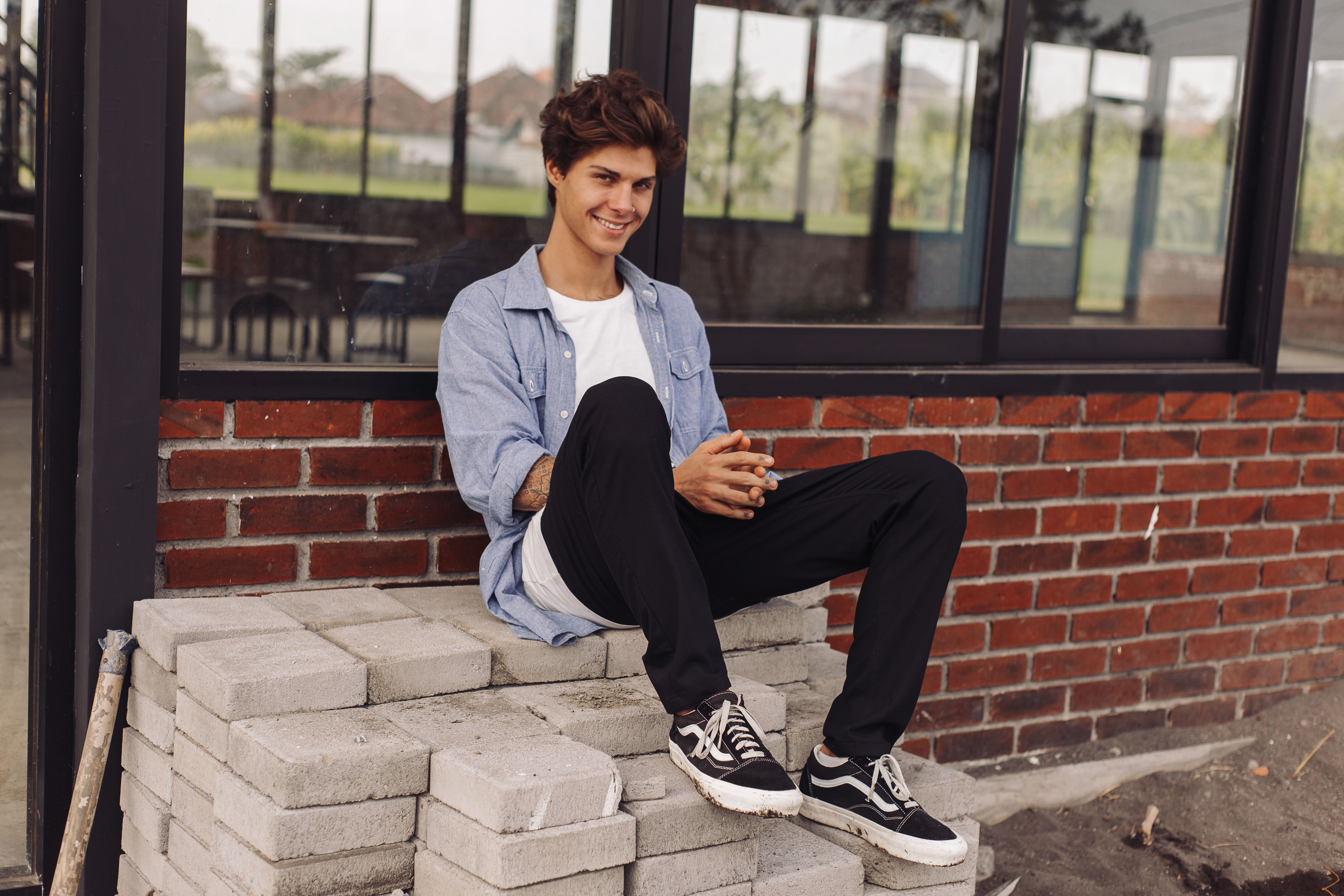 Man Sitting on Bricks · Free Stock Photo