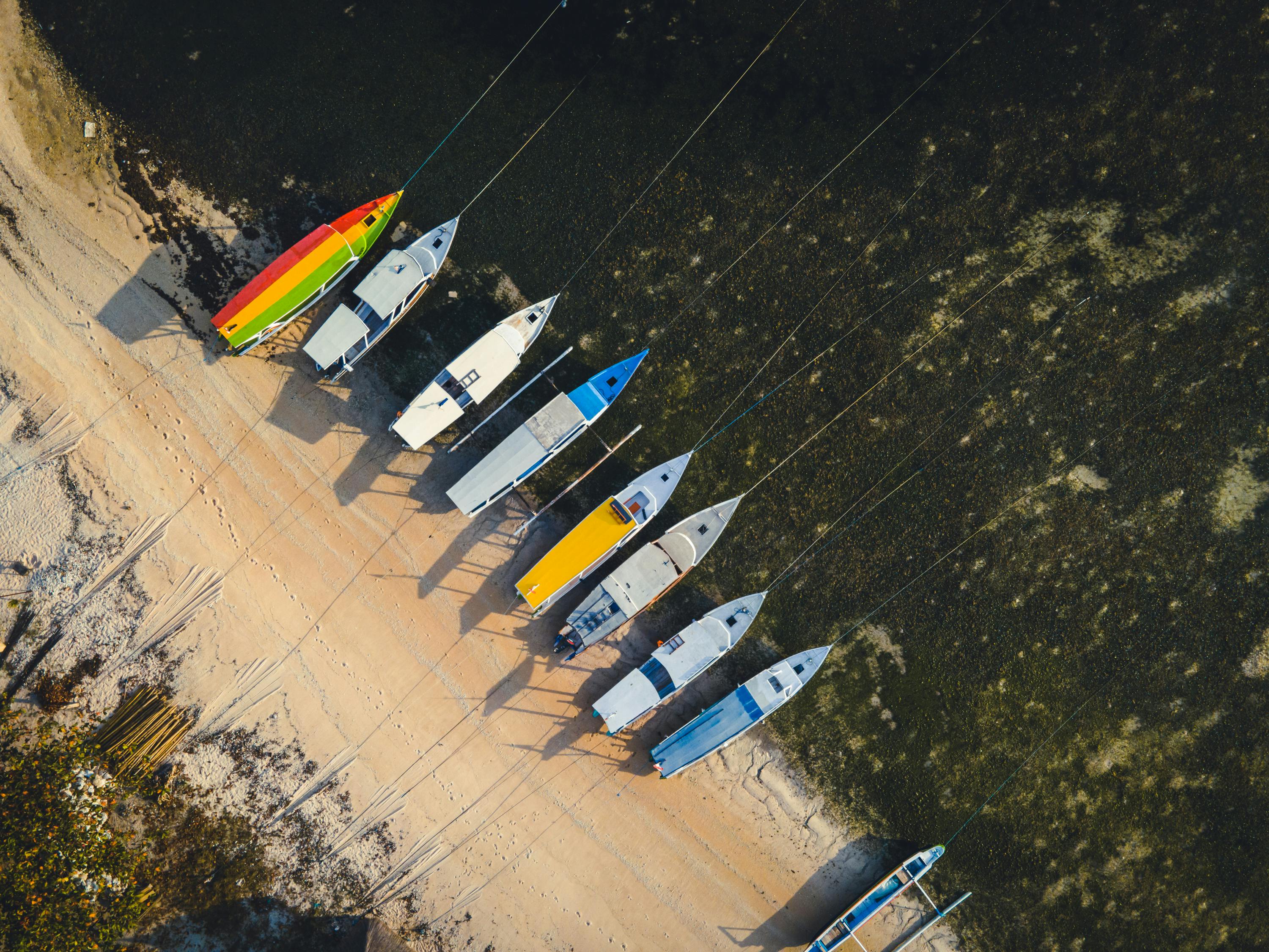 Lined Up Boats on Seashore · Free Stock Photo
