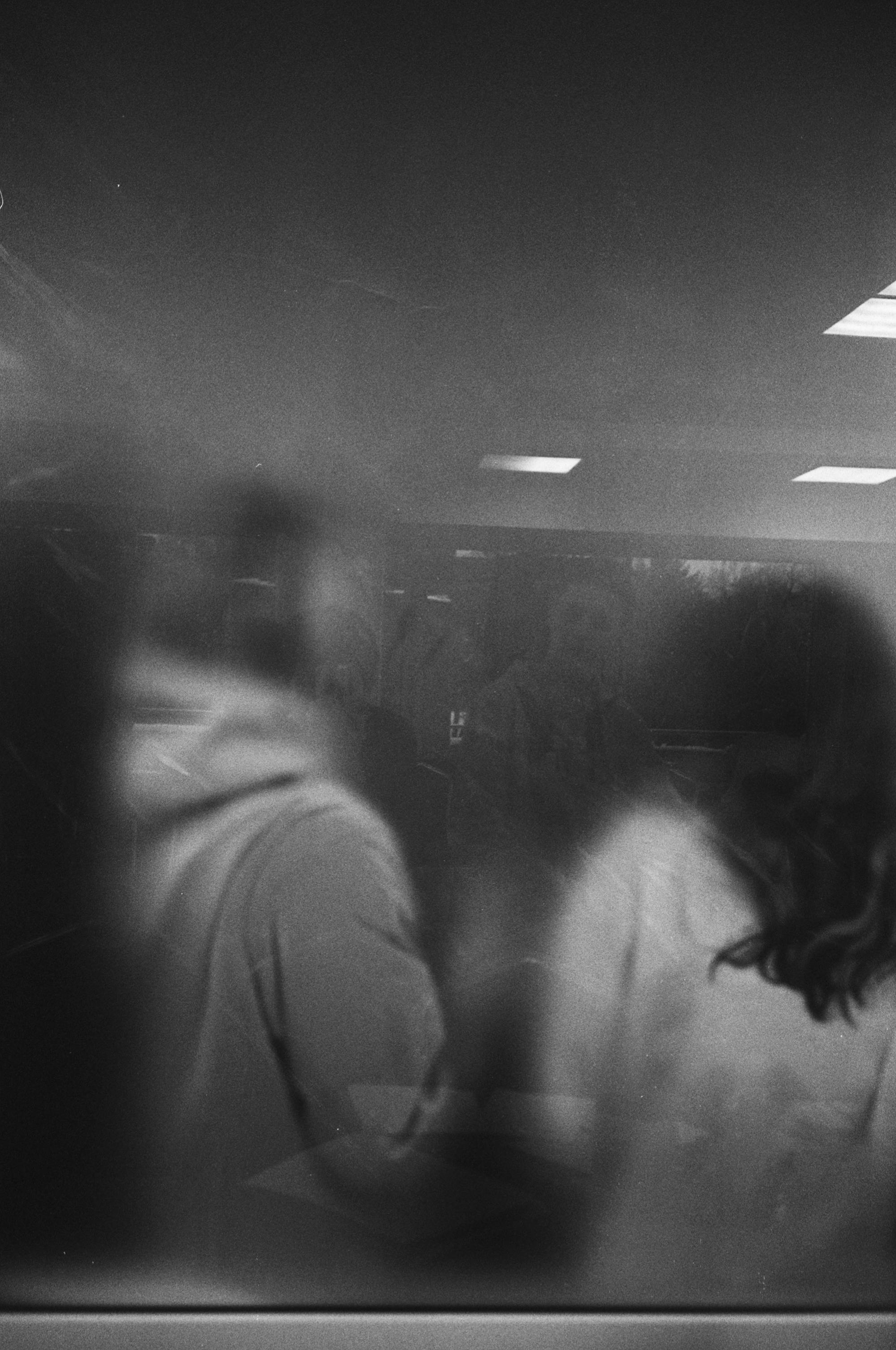 Anonymous women interacting behind glass wall in building · Free Stock ...