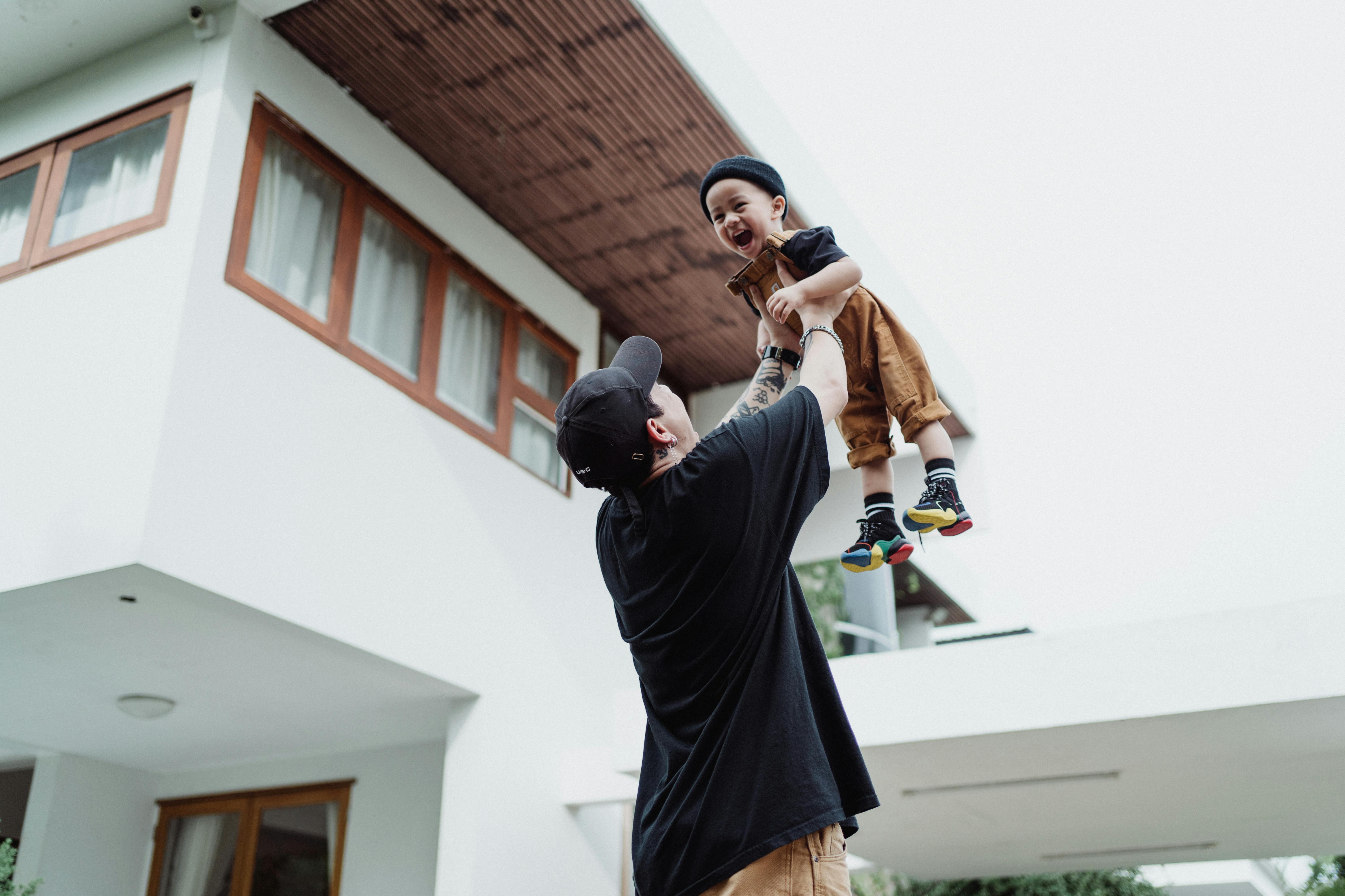 Man Holding Boy aloft · Free Stock Photo