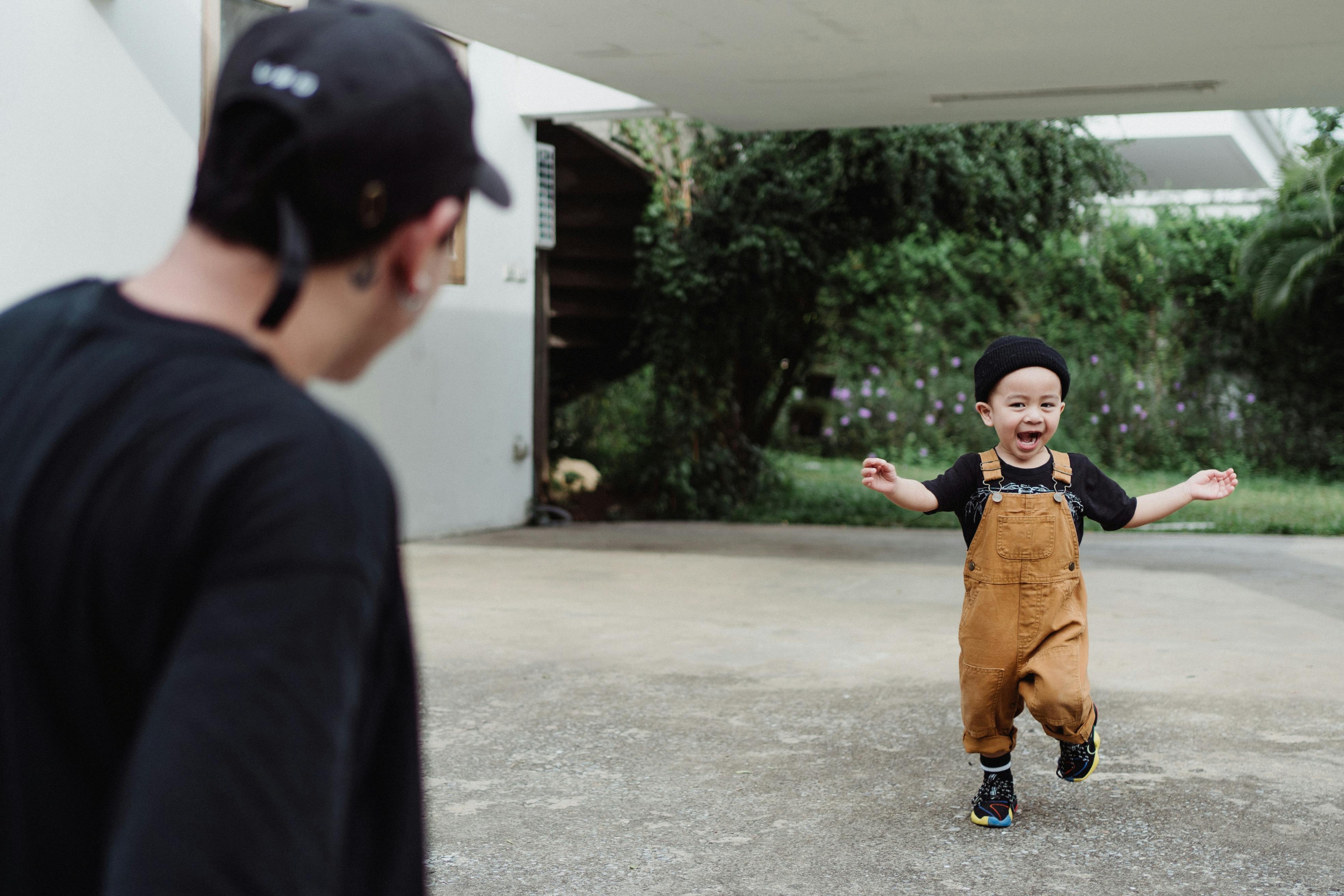 Happy Son Running Towards His Father · Free Stock Photo
