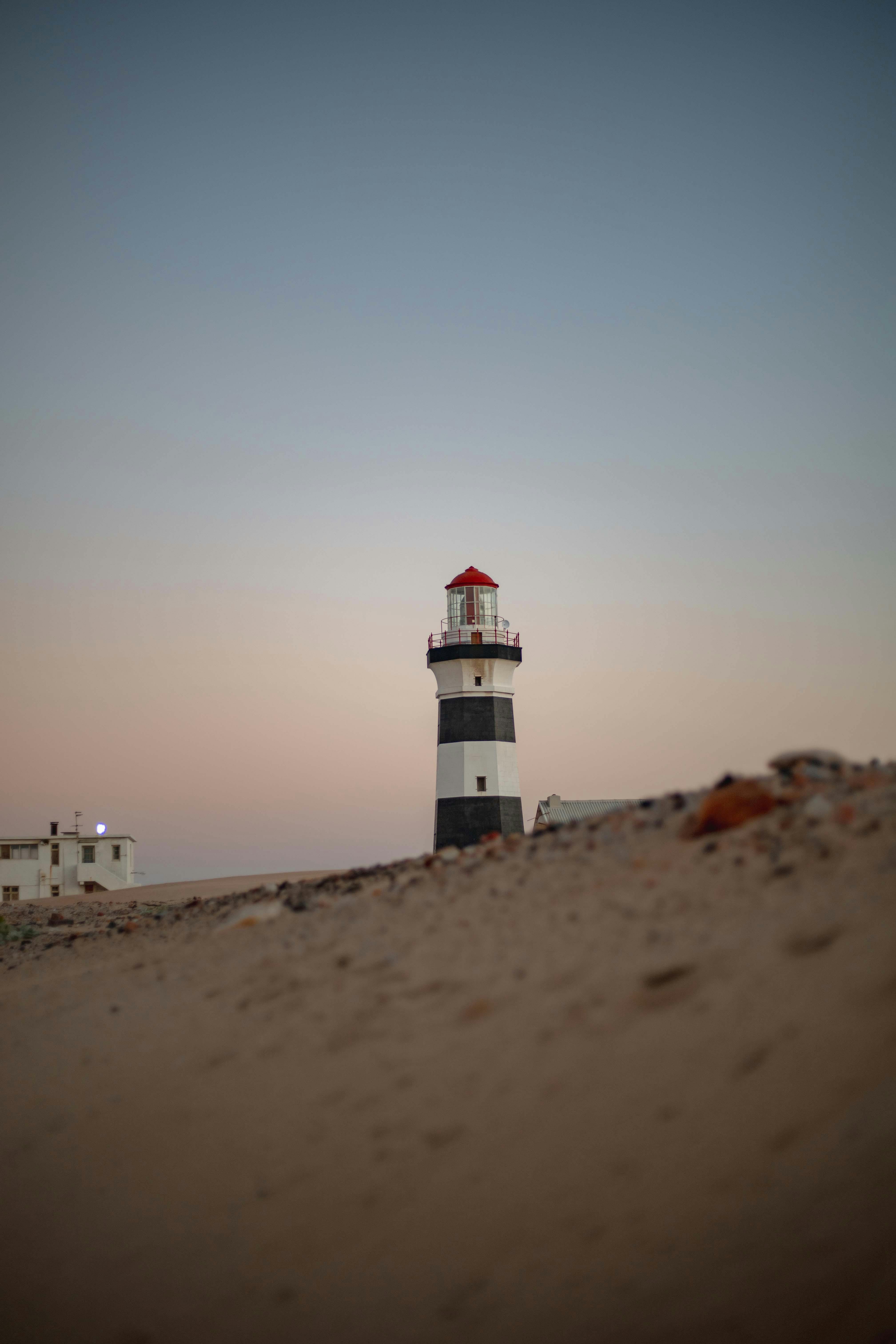 Lighthouse in Sandy Beach at Dawn · Free Stock Photo