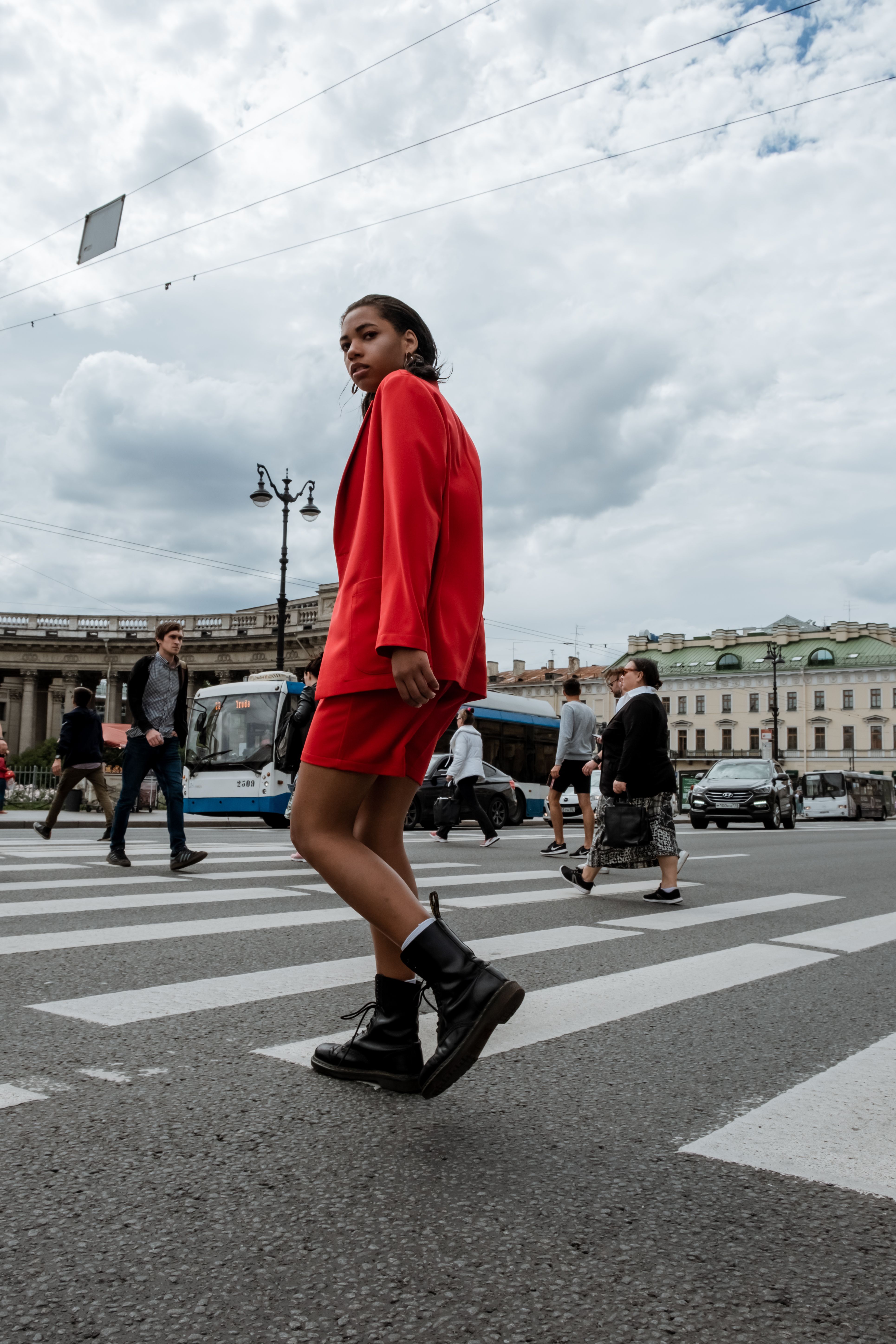 Woman in Red Long Sleeve Dress Walking on Street · Free Stock Photo