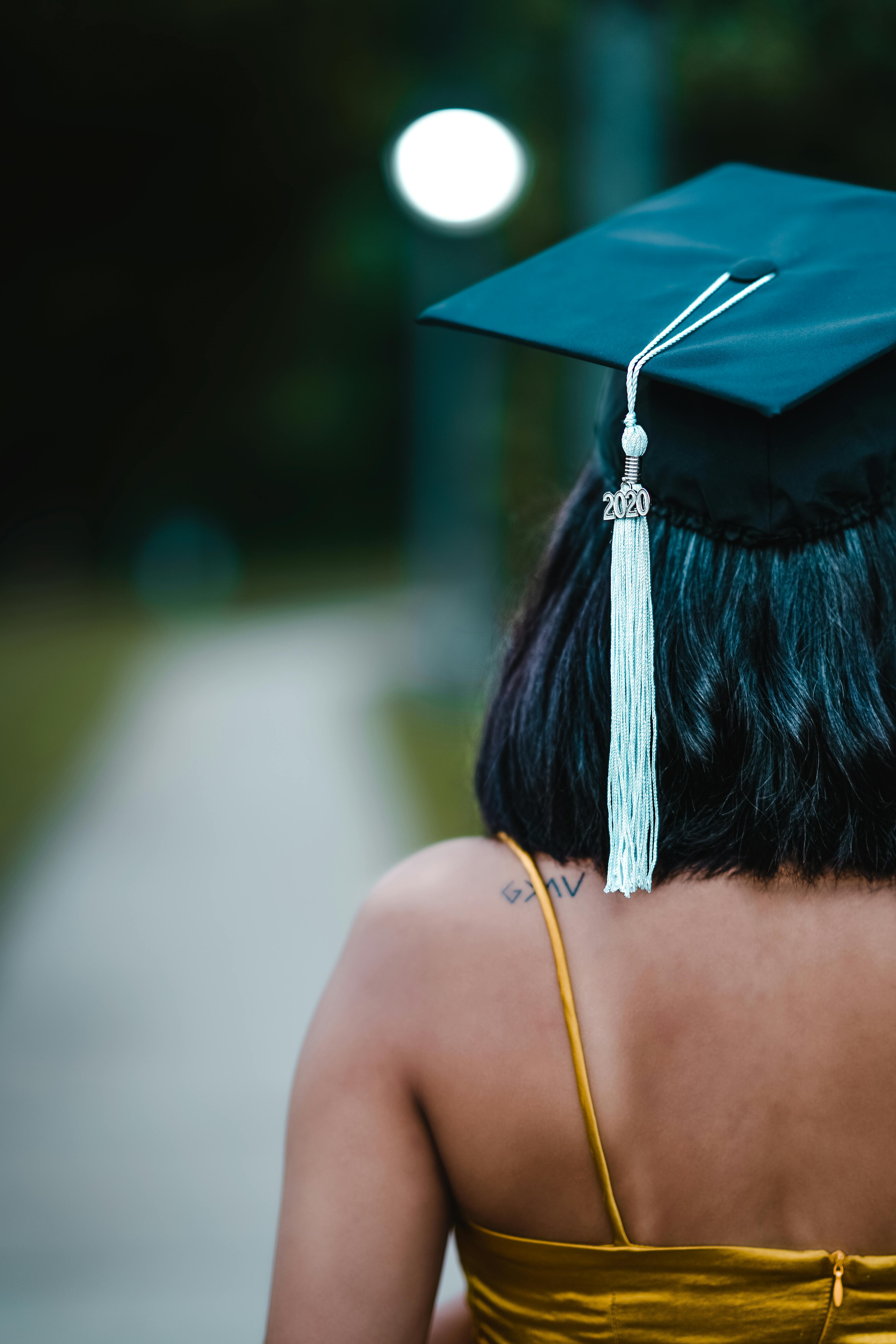 Crop woman in graduation cap · Free Stock Photo