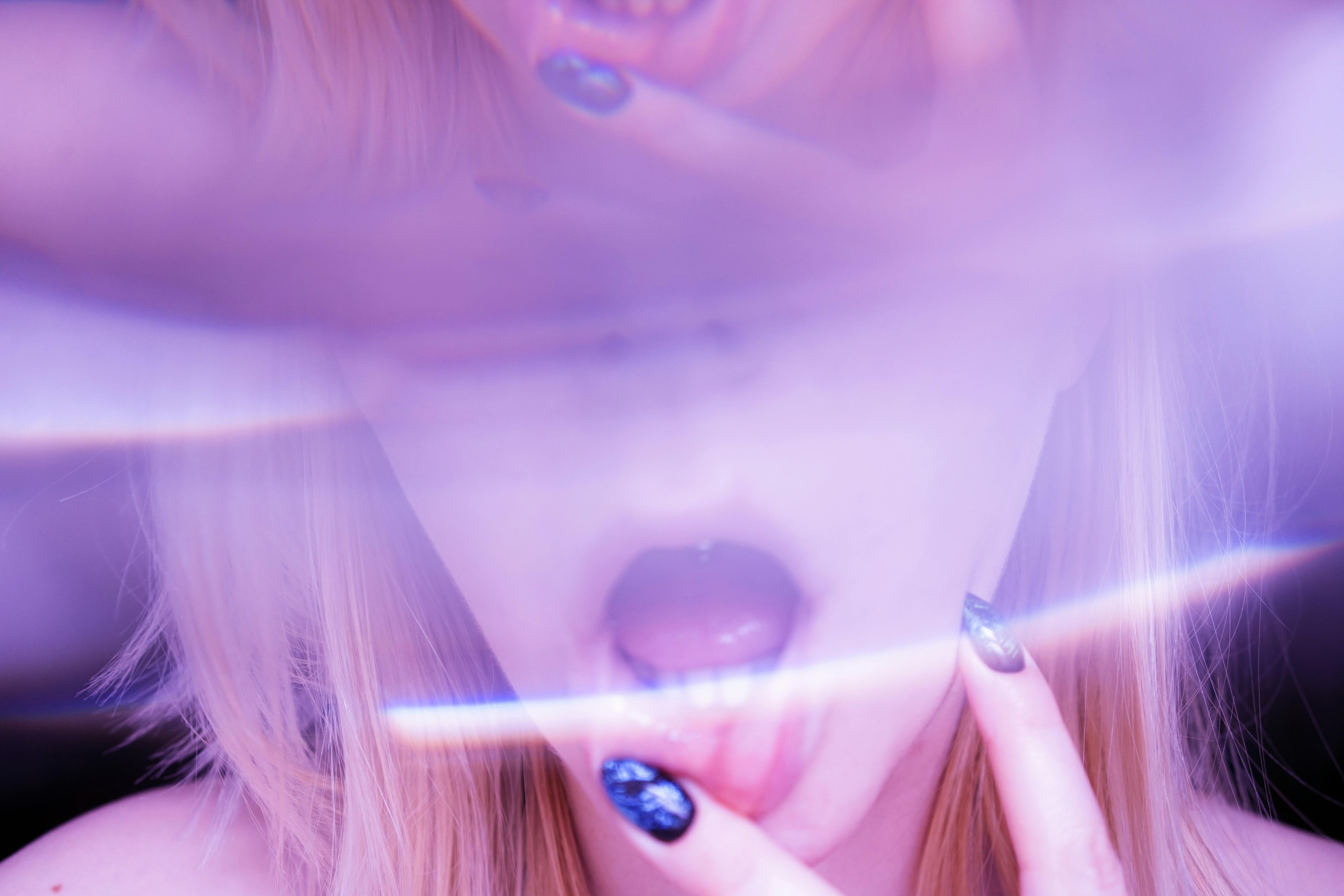 Anonymous woman pulling bottom lip · Free Stock Photo