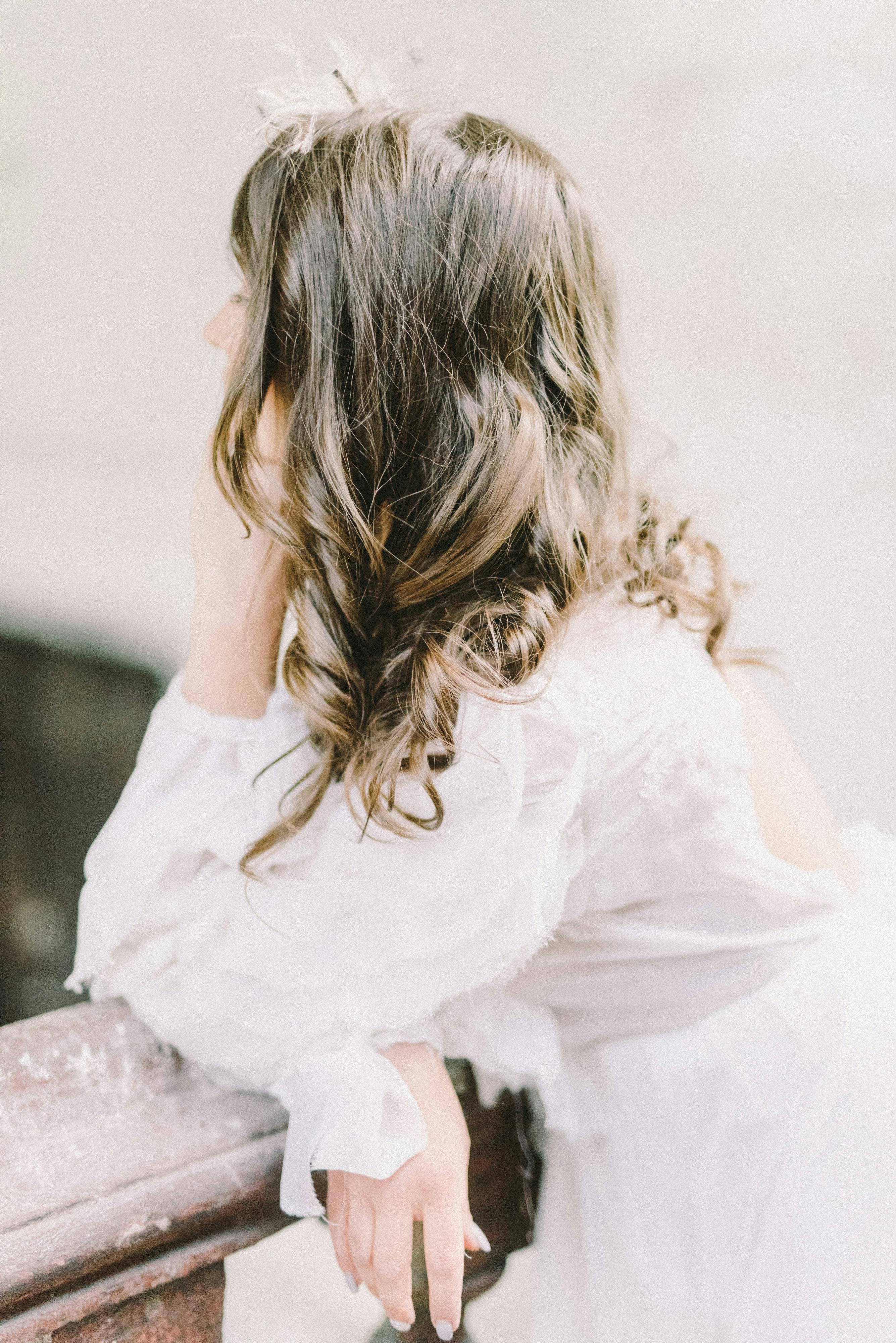 Girl Leaning on Railing with Chin on Arm · Free Stock Photo
