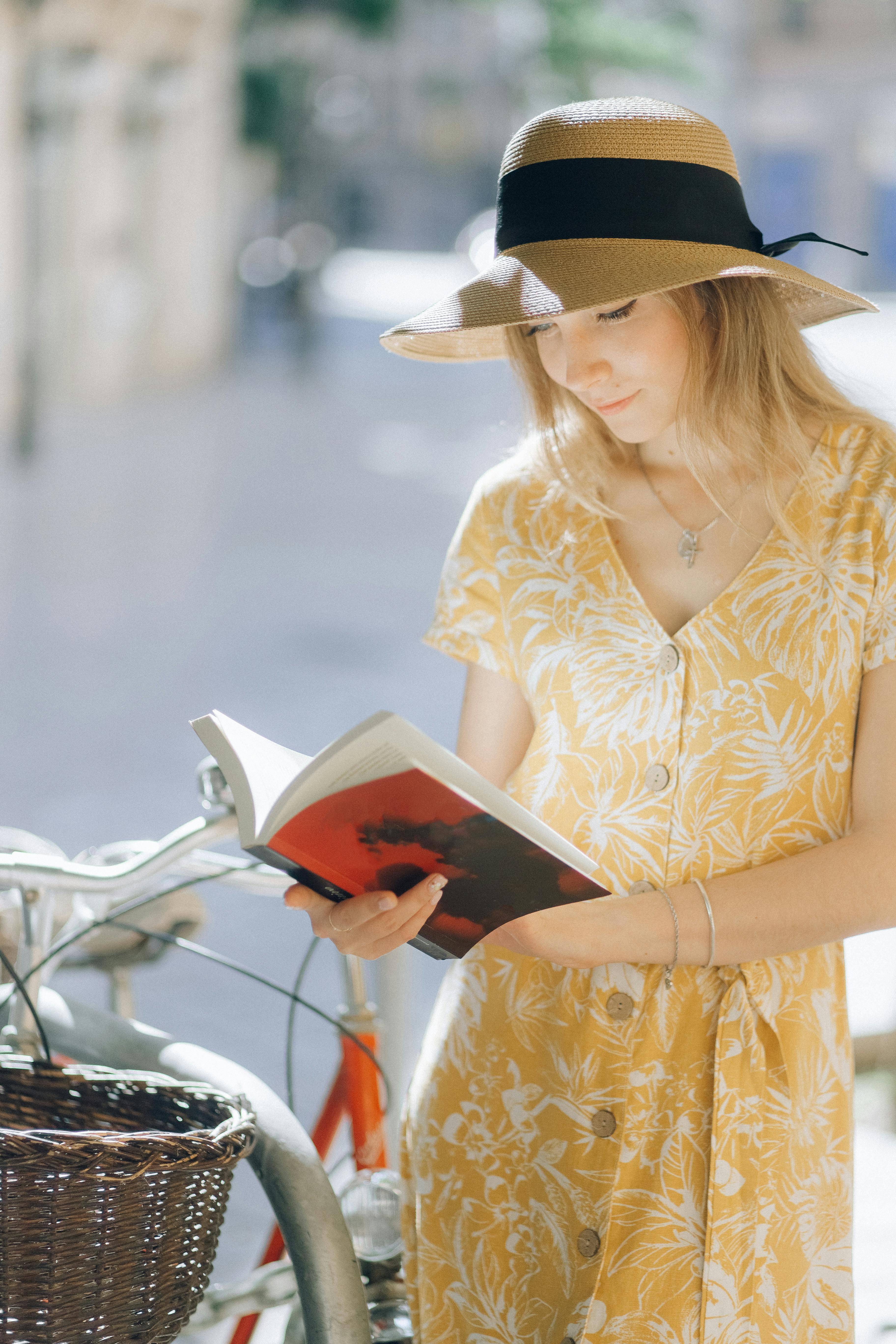 Woman in Yellow Dress Reading a Book · Free Stock Photo