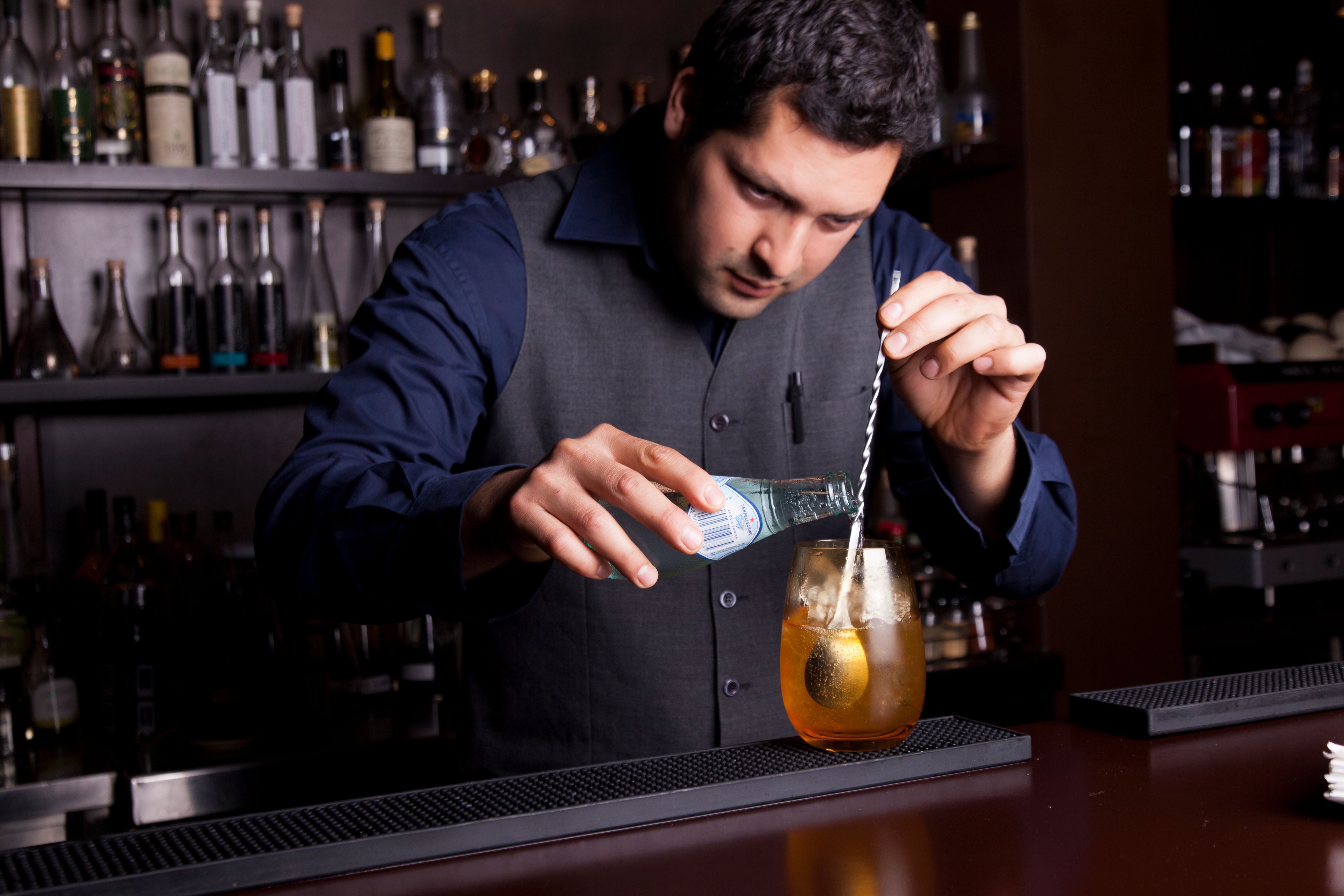 A Man Making Alcoholic Beverage · Free Stock Photo