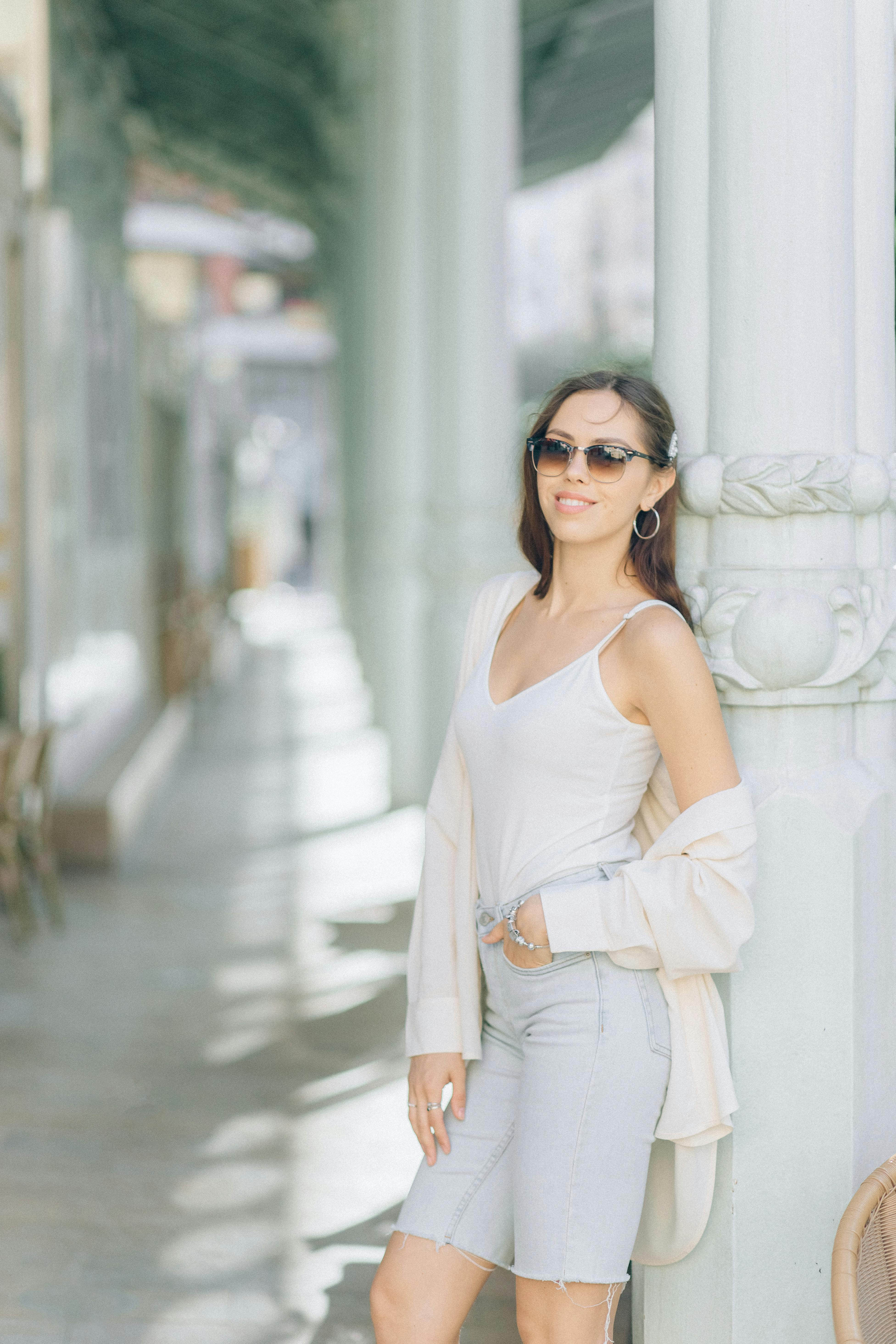 Woman Leaning on a Pillar · Free Stock Photo