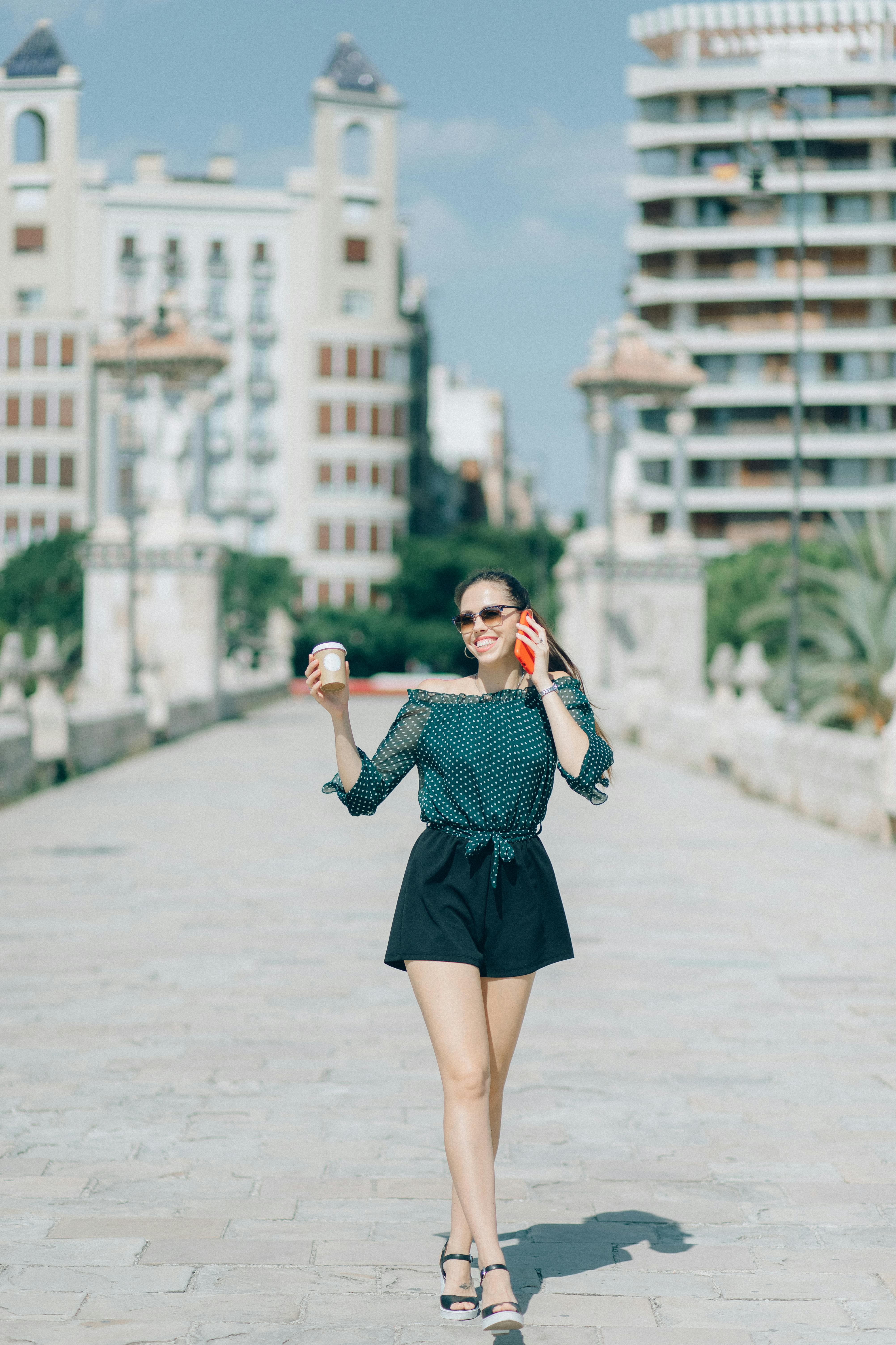 Woman Walking While Talking on the Phone · Free Stock Photo