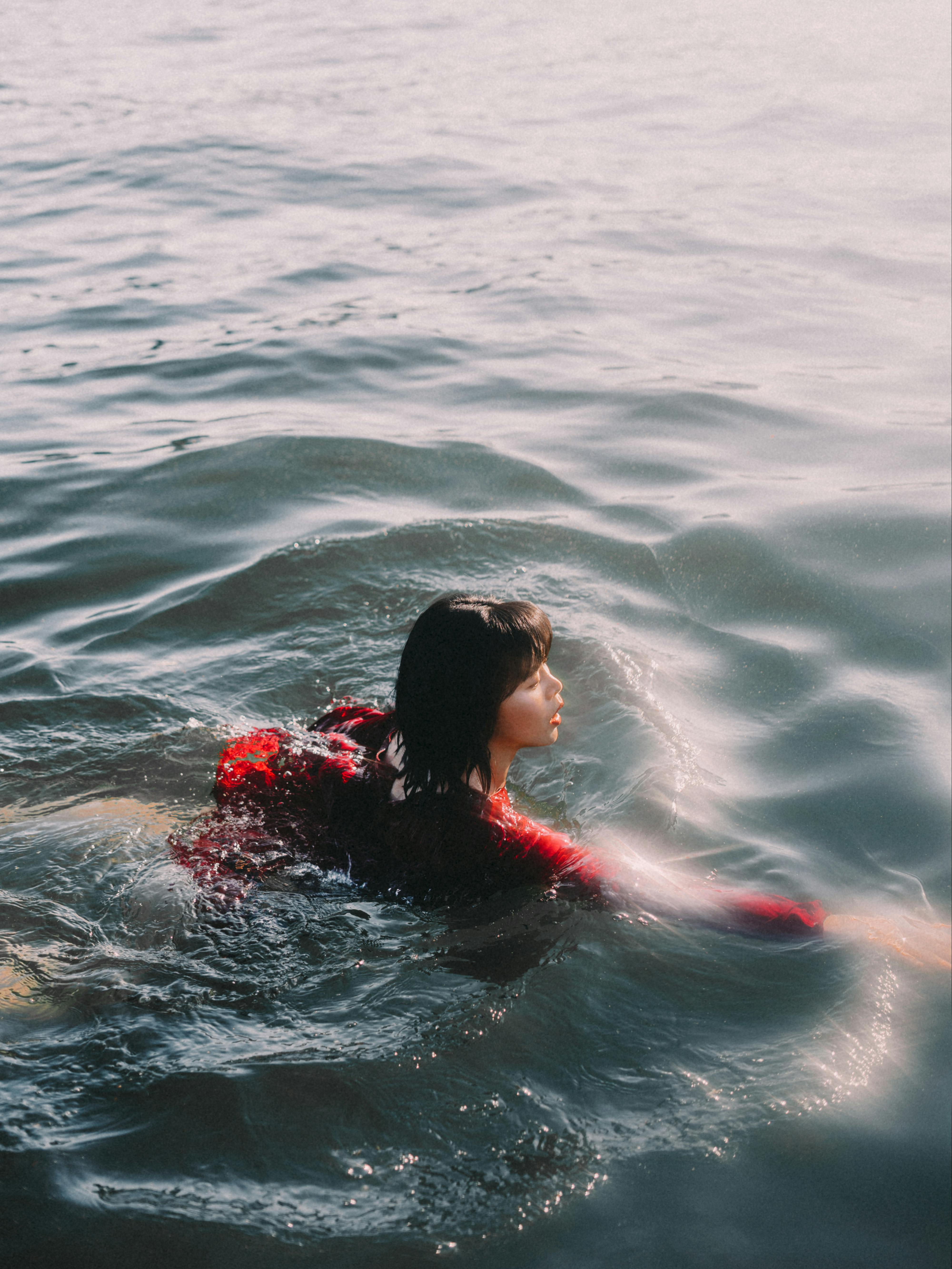 Woman swimming in clean water of river · Free Stock Photo