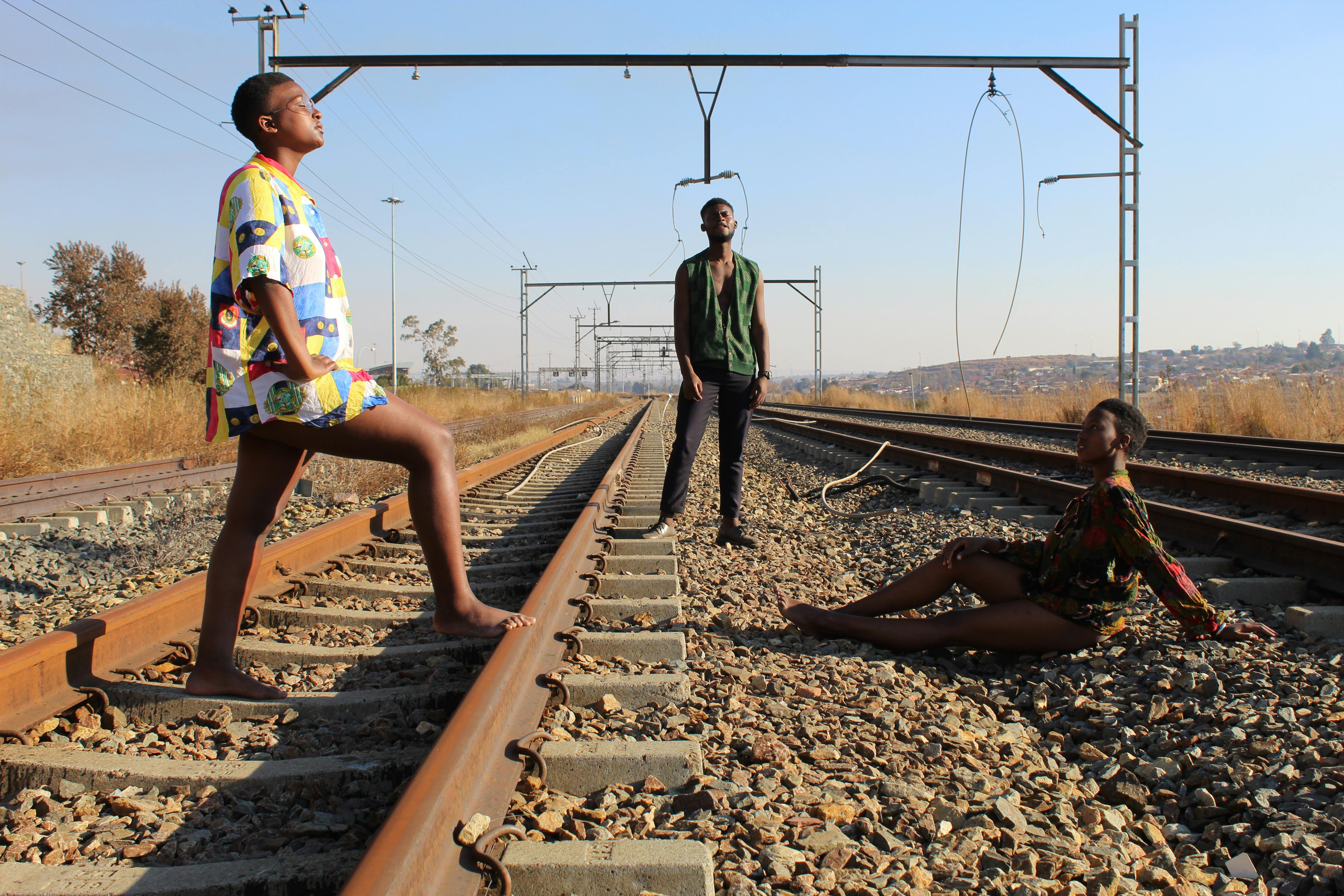 People Posing on Railway Track · Free Stock Photo