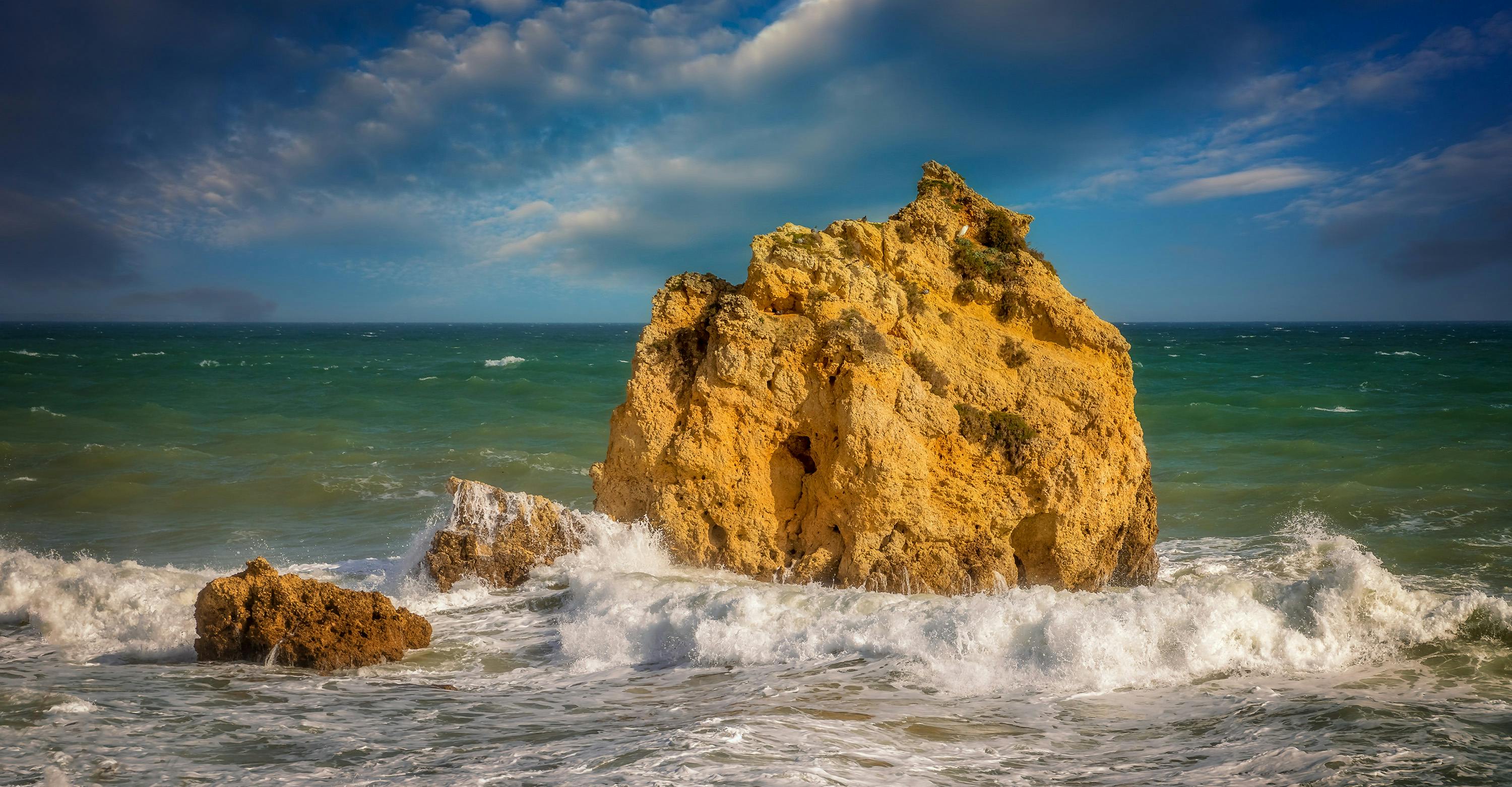 Brown Rock Formation near Ocean · Free Stock Photo