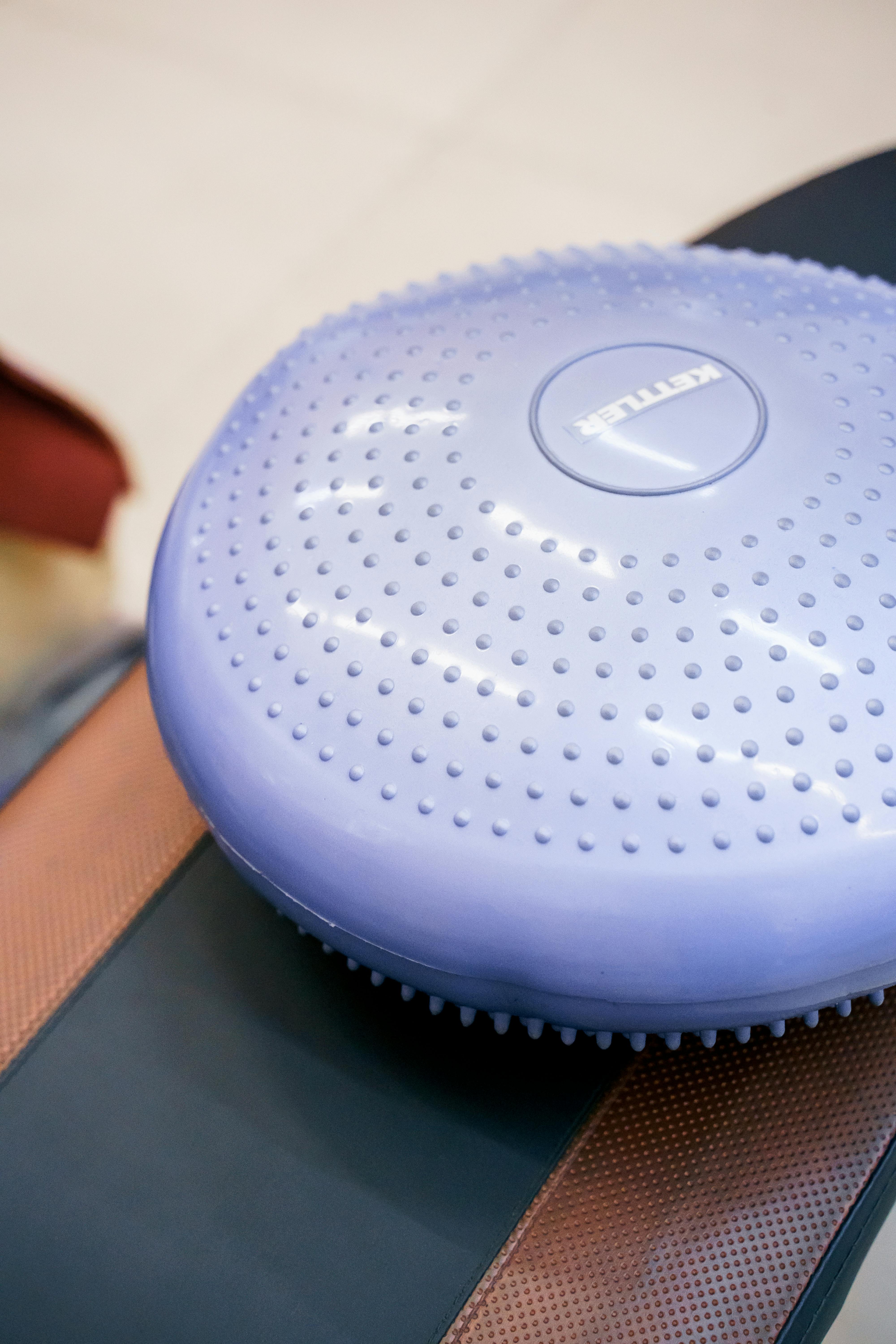 Balance round board placed on mat in gym · Free Stock Photo