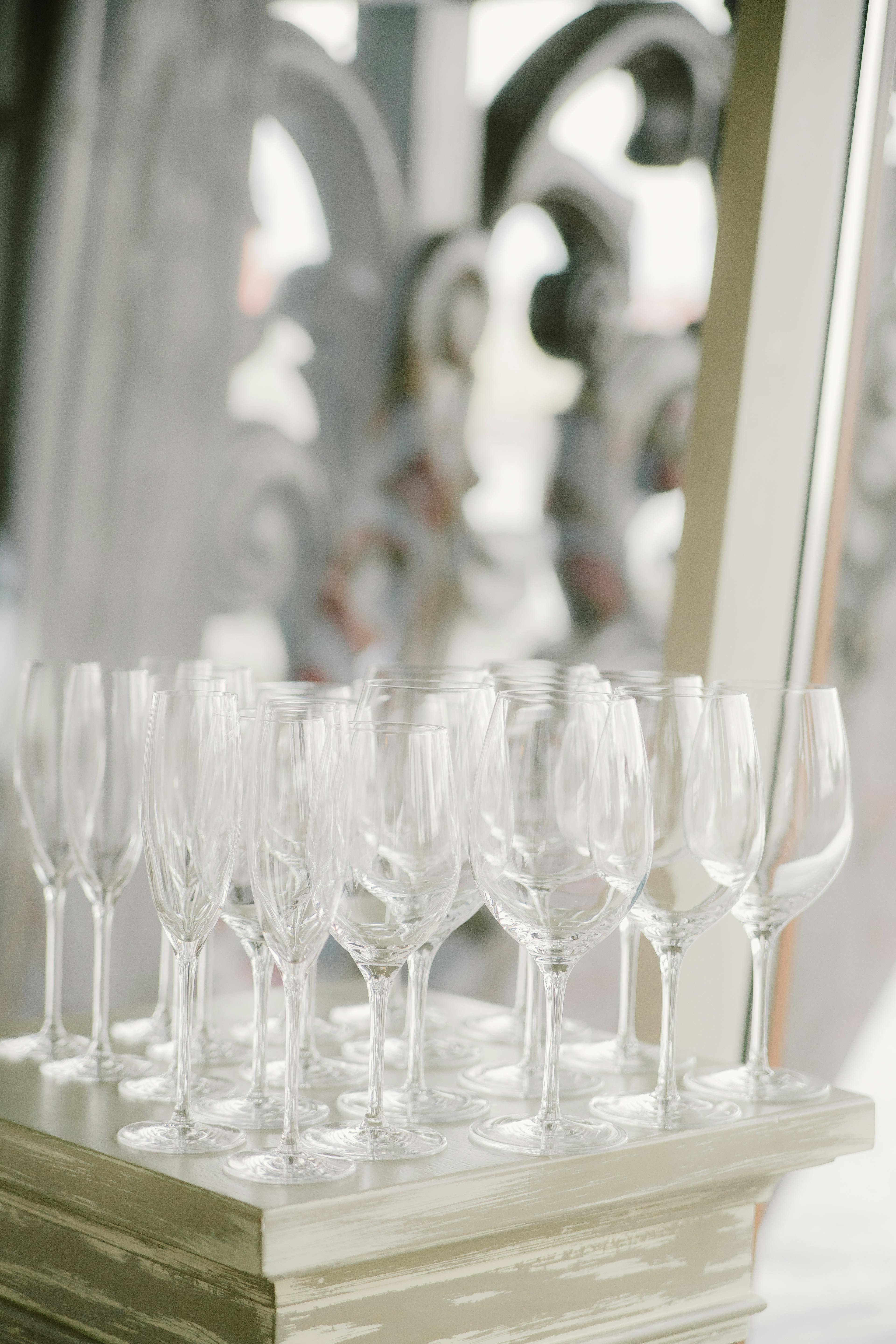 Elegant crystal glasses placed on table during wedding celebration ...