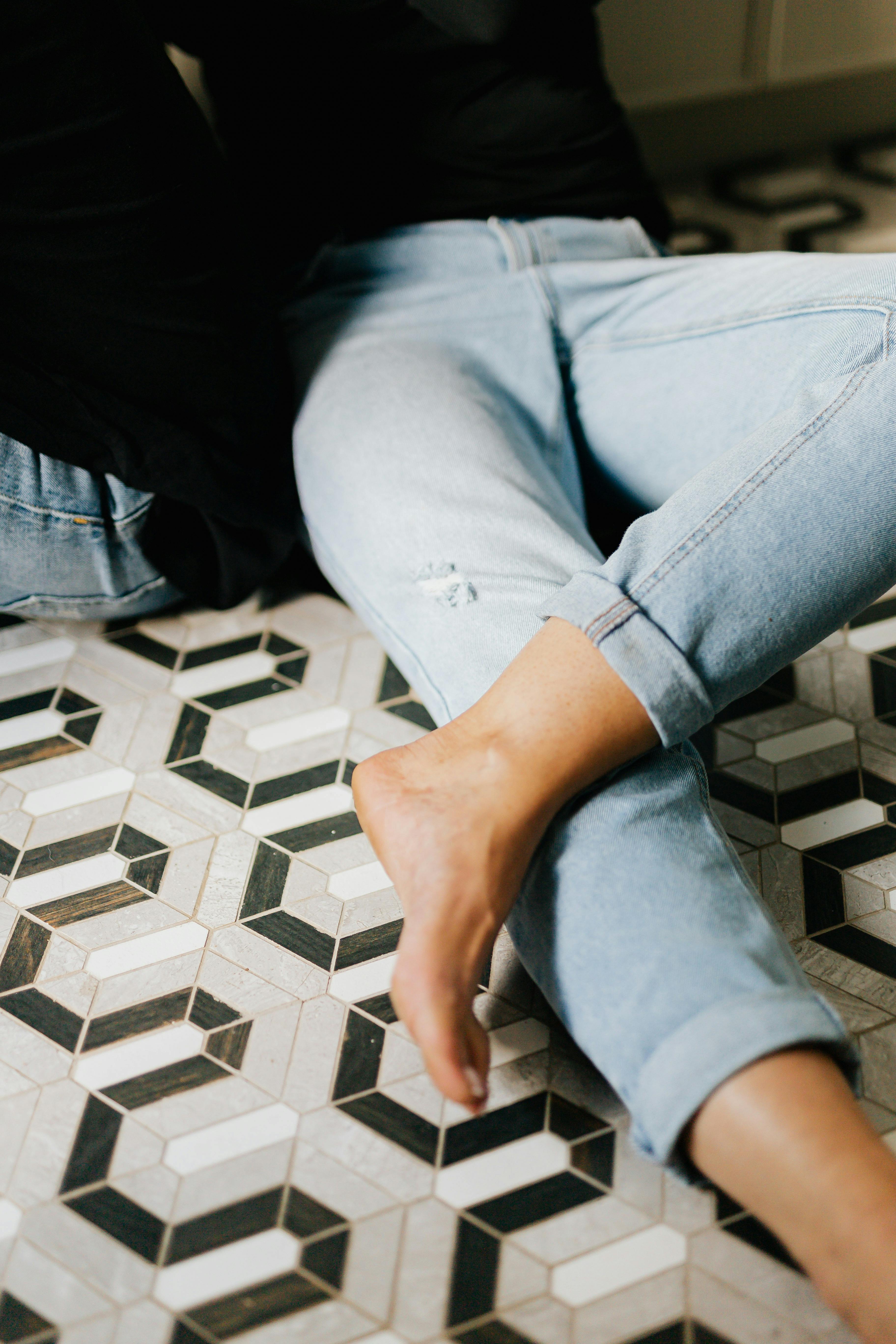 Person in Black Top and Blue Denim Jeans · Free Stock Photo