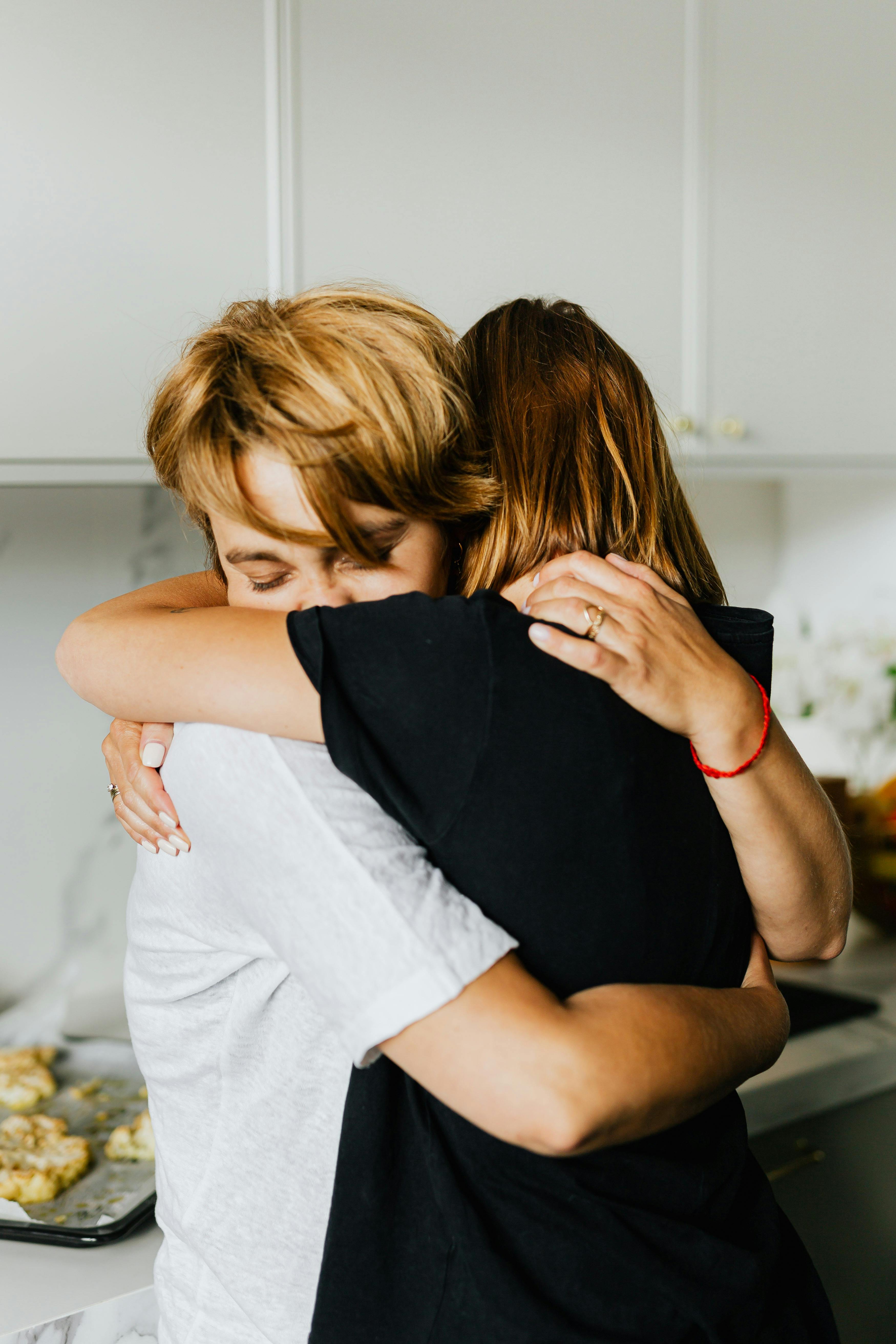 Woman Hugging Another Woman · Free Stock Photo
