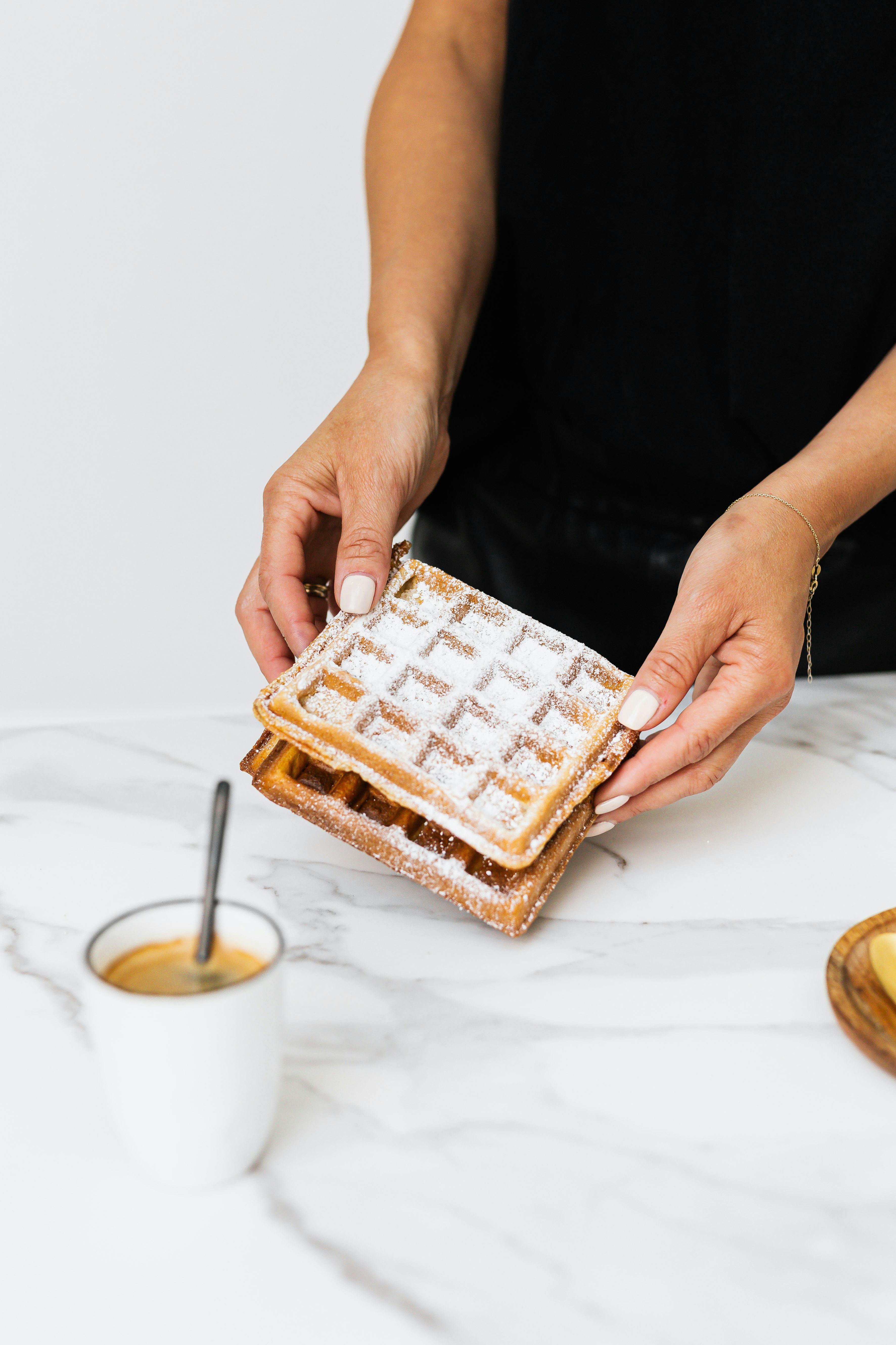 A Person Holding Waffles · Free Stock Photo