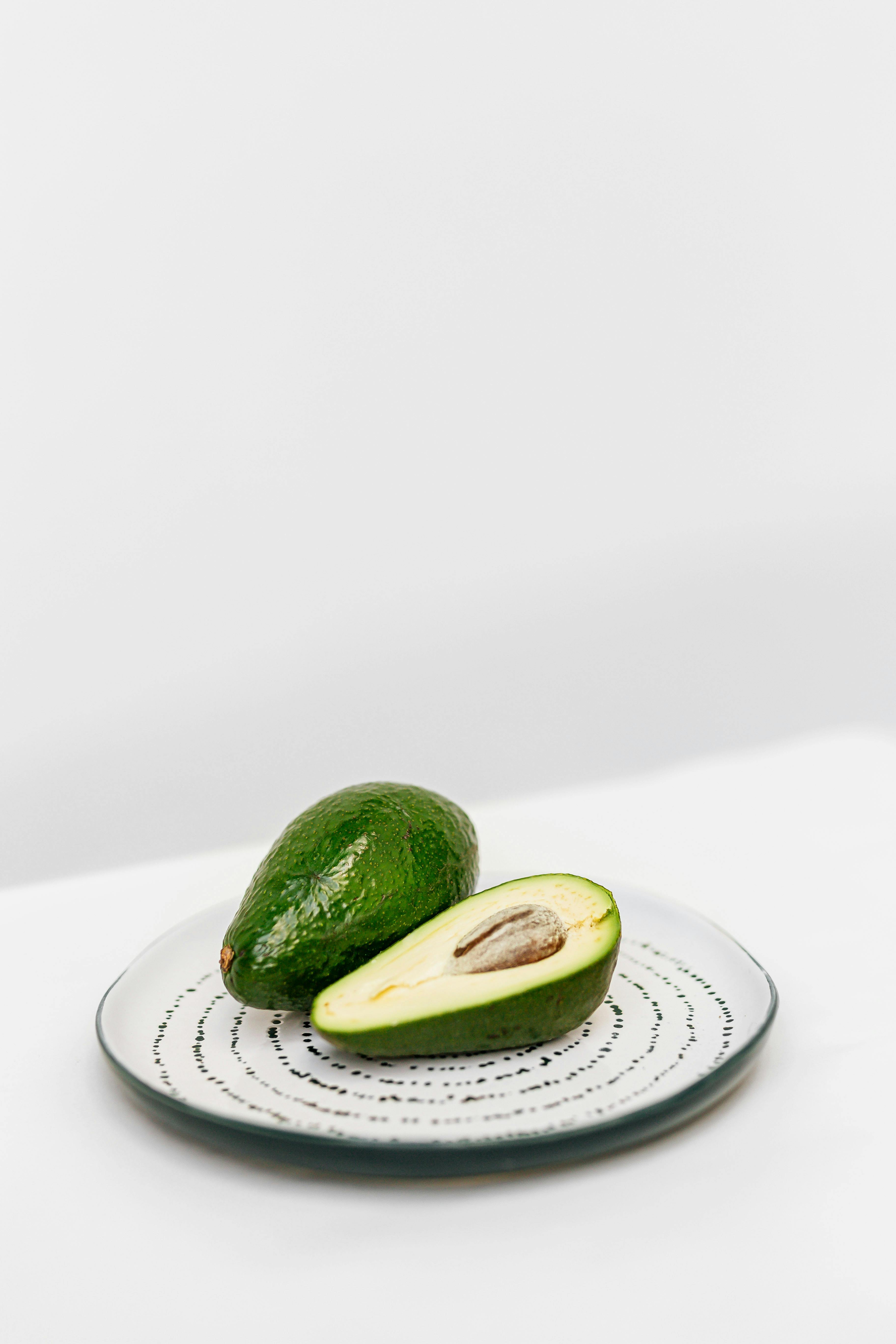 Sliced Avocado on a Ceramic Plate · Free Stock Photo
