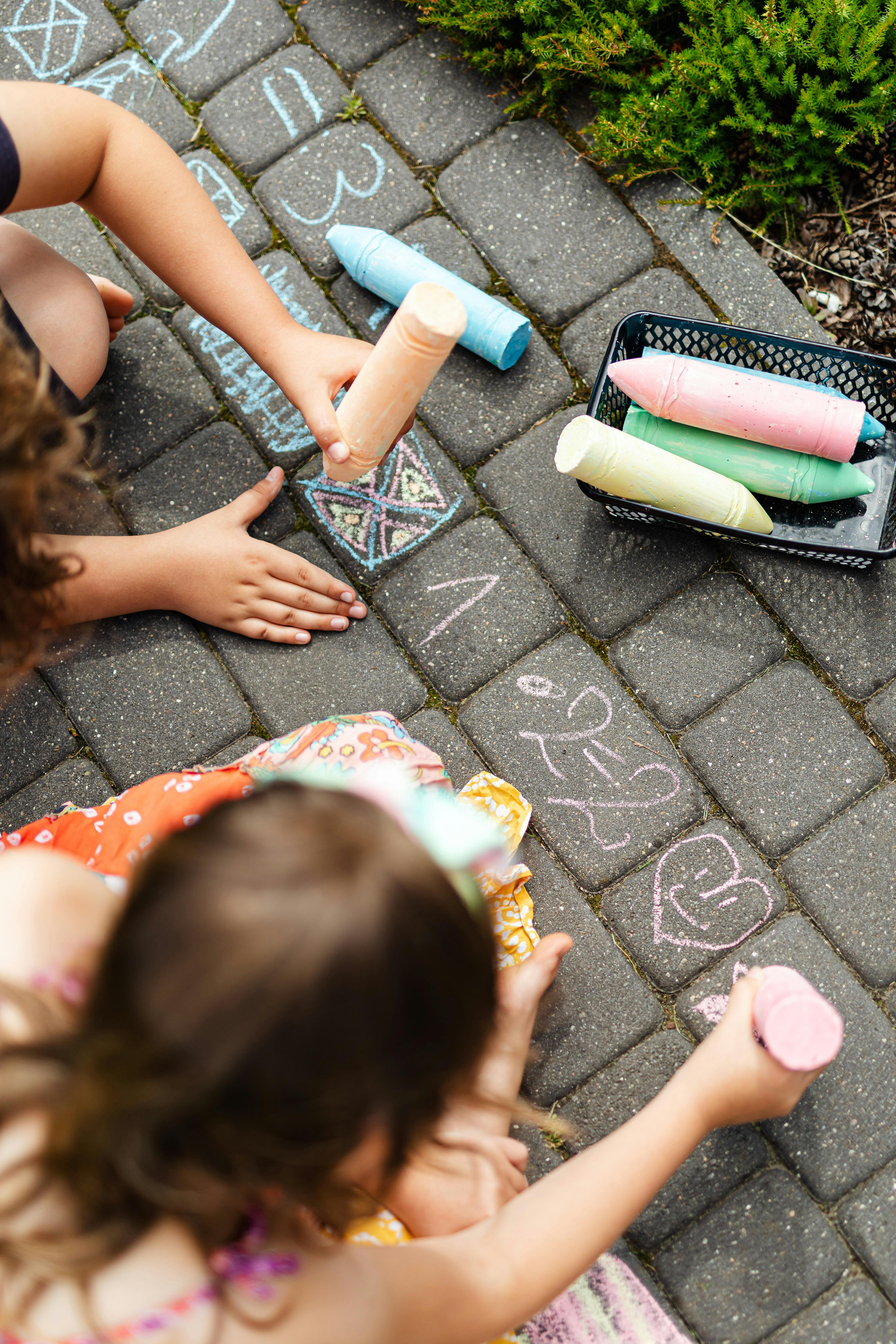 Children Drawing on a Pavement · Free Stock Photo