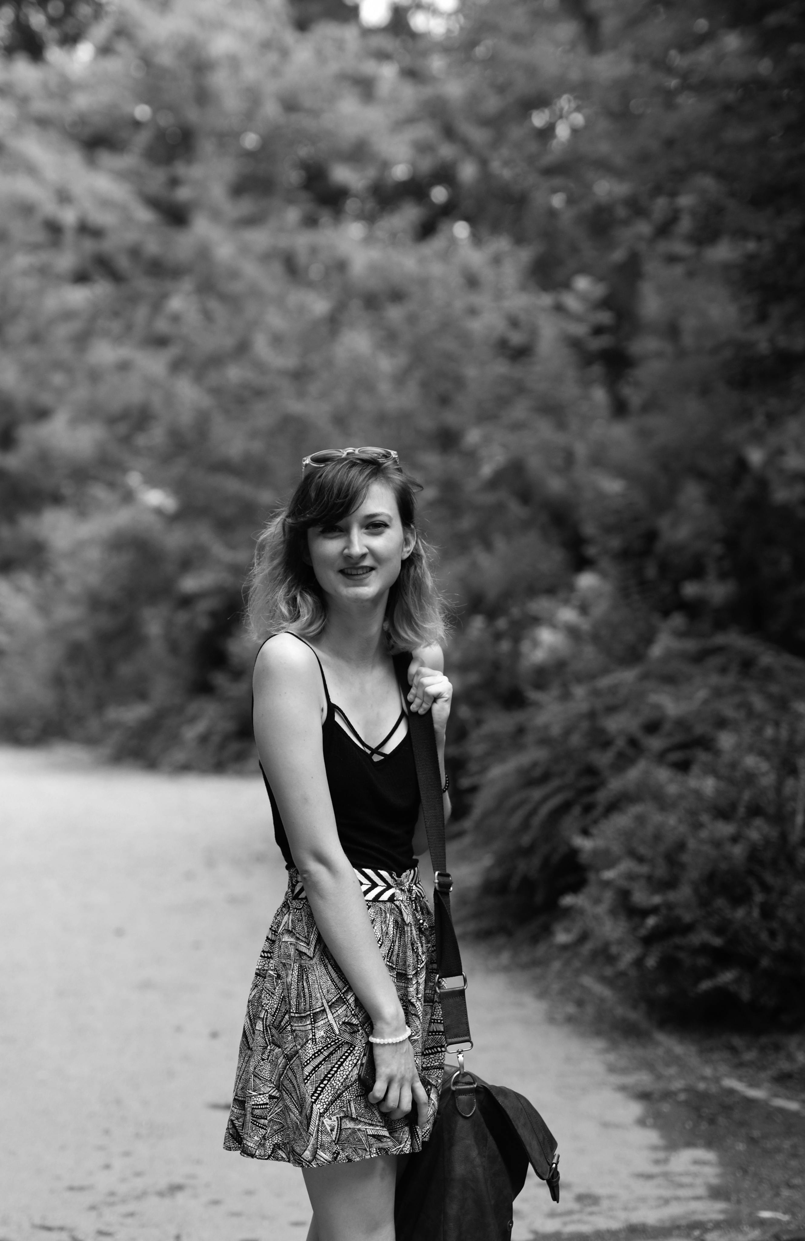 A Grayscale of a Woman on the Road · Free Stock Photo