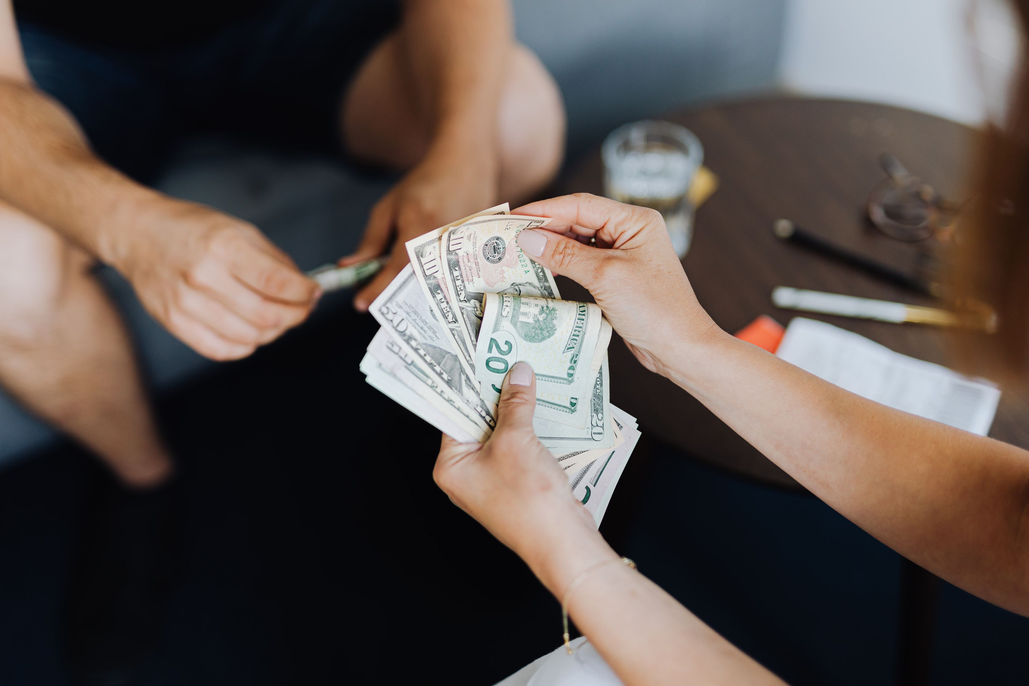 Person Counting Dollar Bills Free Stock Photo Person Counting Dollar Bills Free Stock Photo