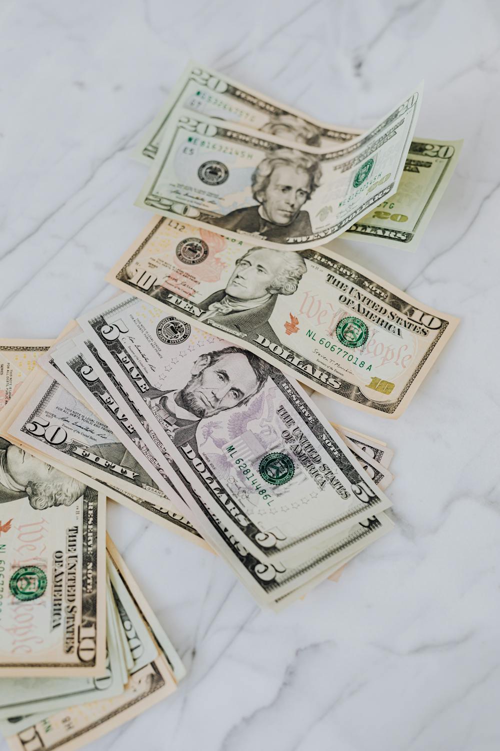 US Dollars On Marble Free Stock Photo US Dollars On Marble Free Stock Photo