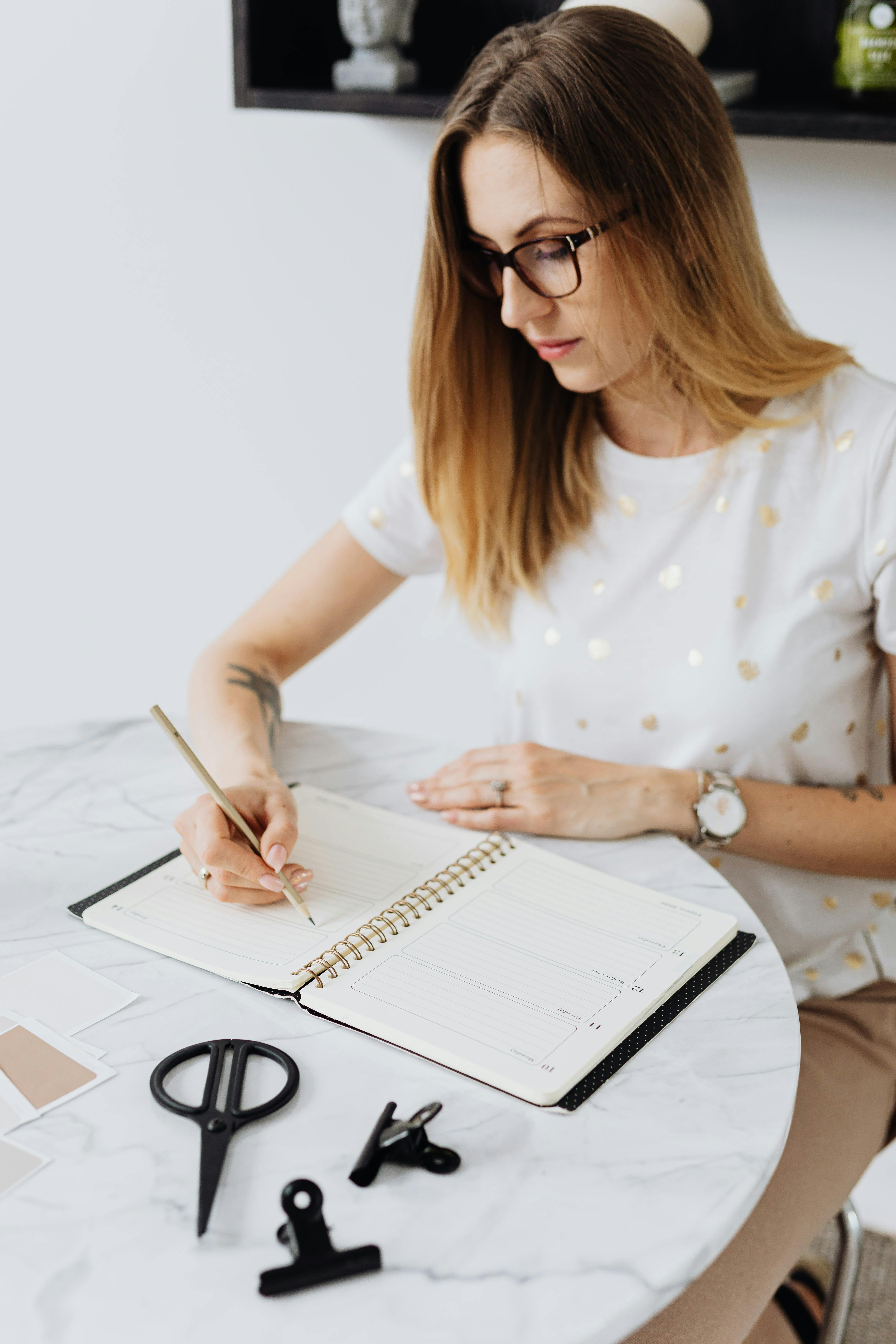 Calm crop woman with mock up notebook · Free Stock Photo