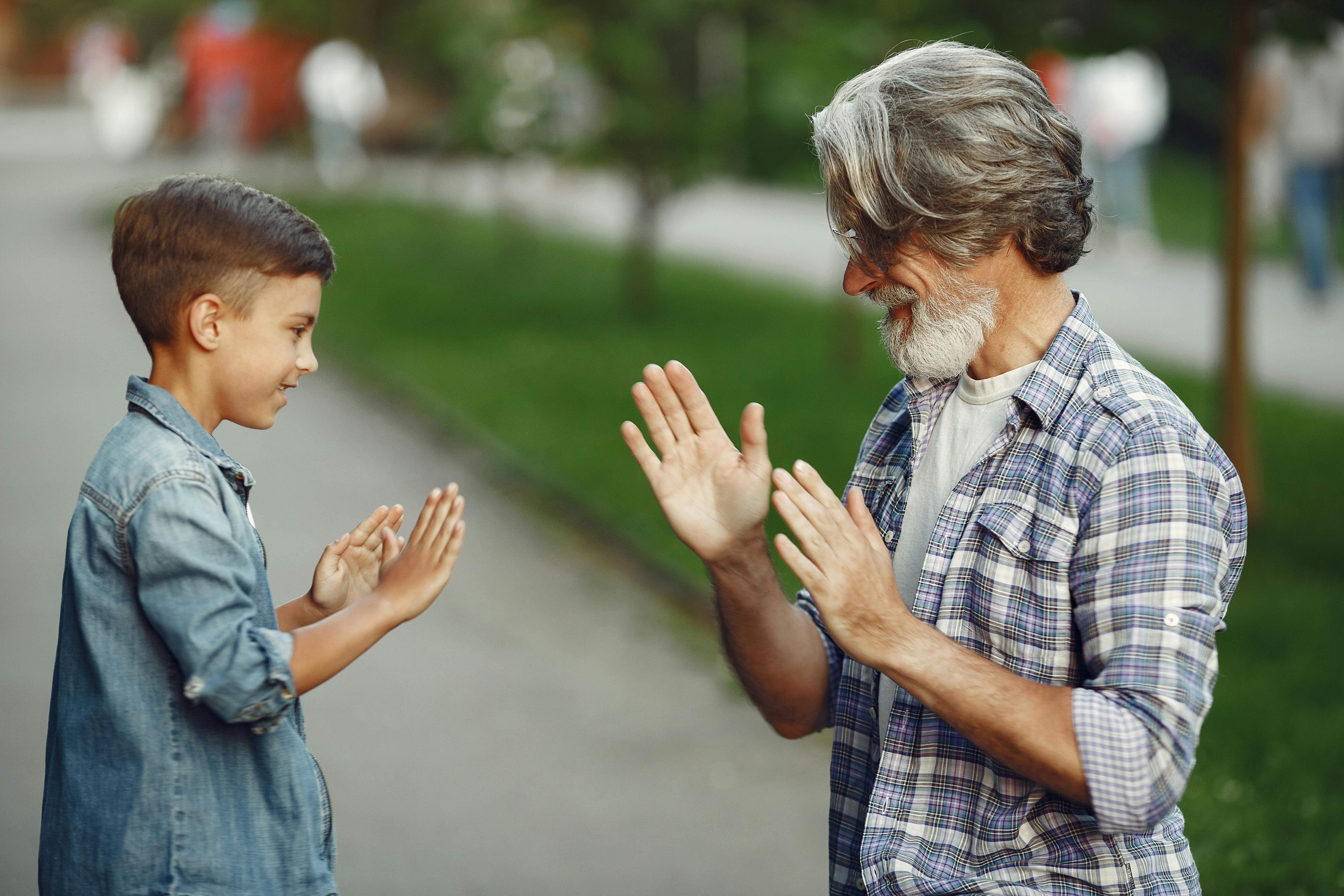 Man and Boy Clapping Hands · Free Stock Photo