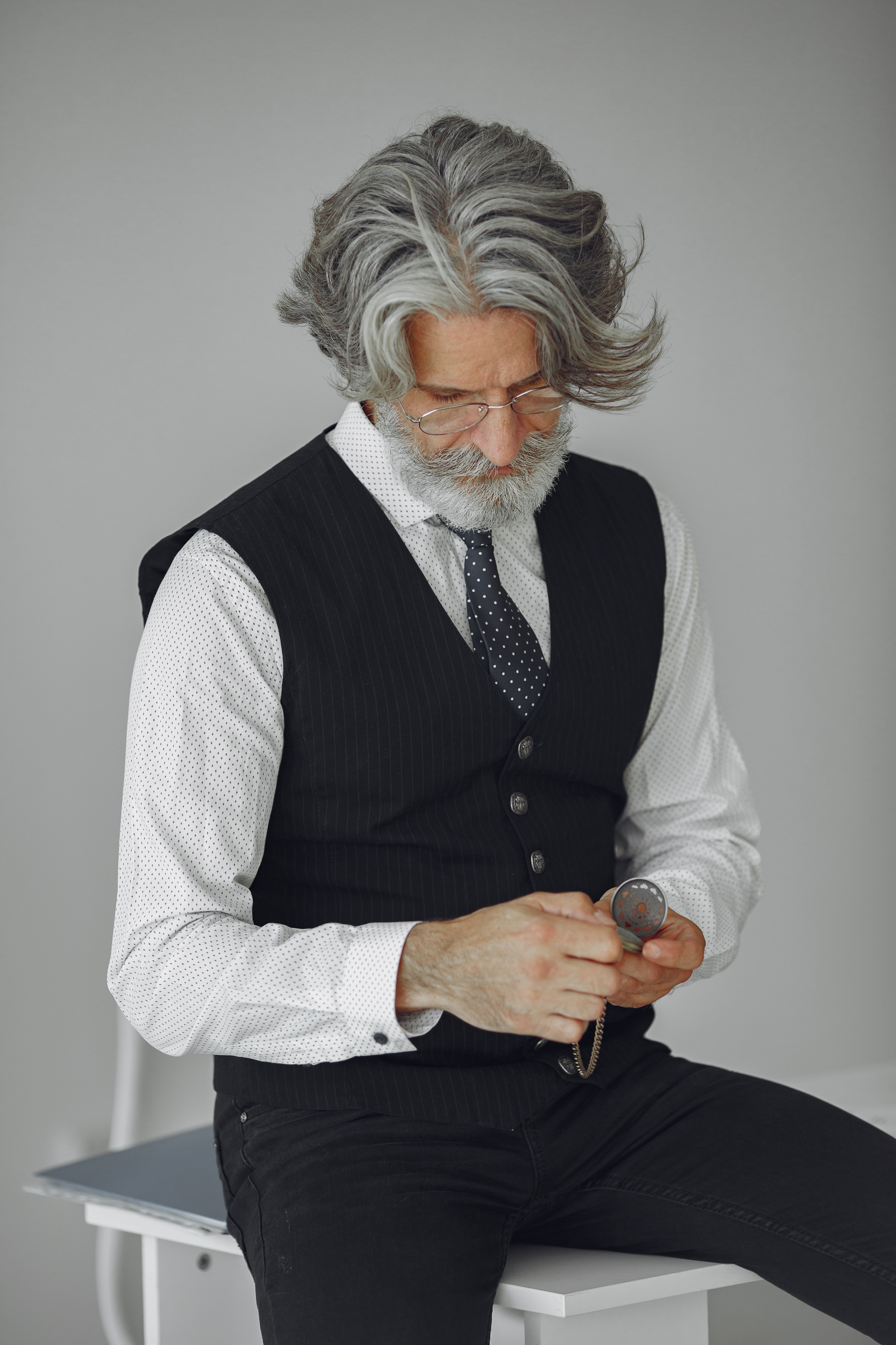 Man Holding a Pocket Watch · Free Stock Photo